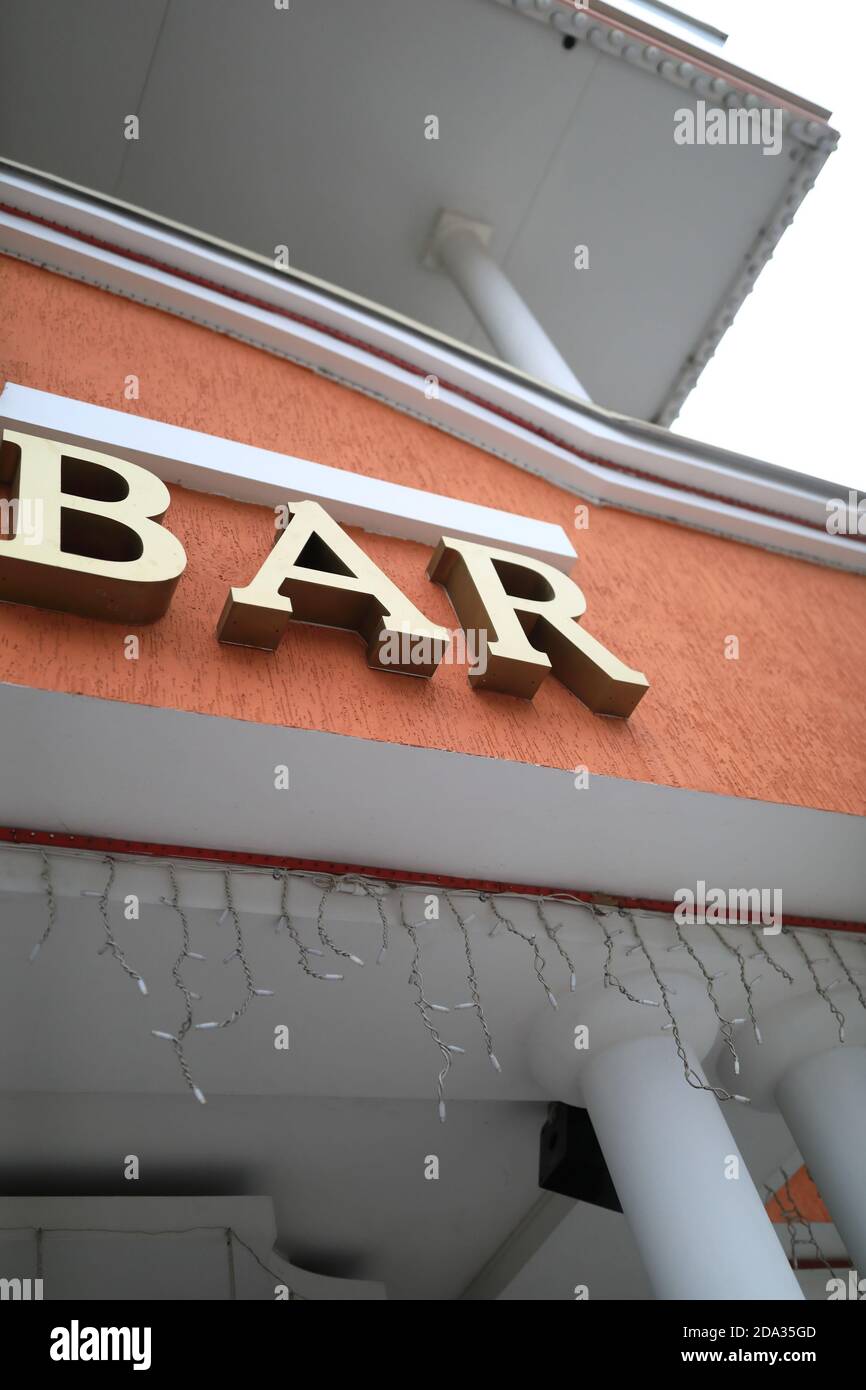 Bar sign on wall of building, Russia Stock Photo - Alamy
