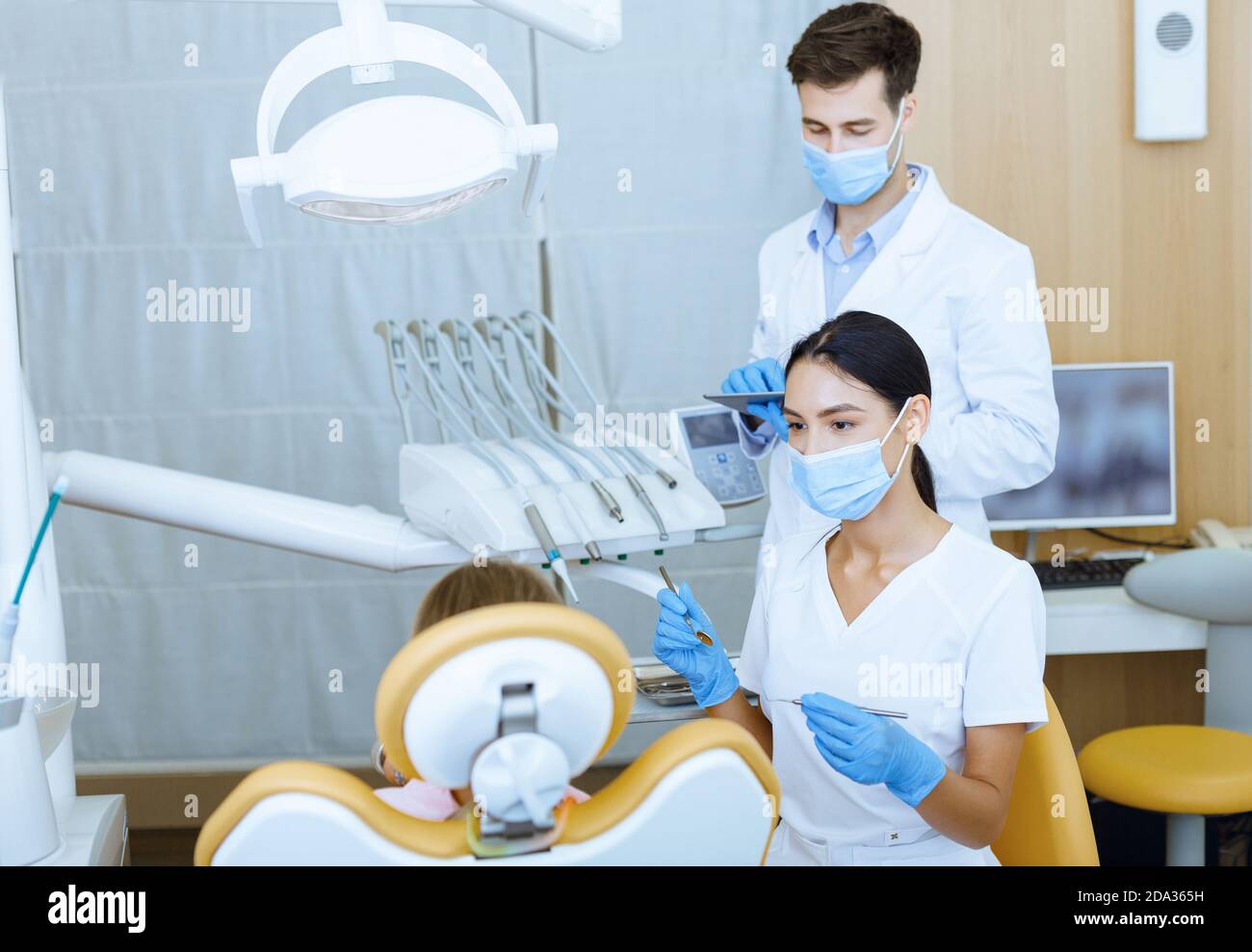 Work of specialist doctors with children teeth Stock Photo - Alamy