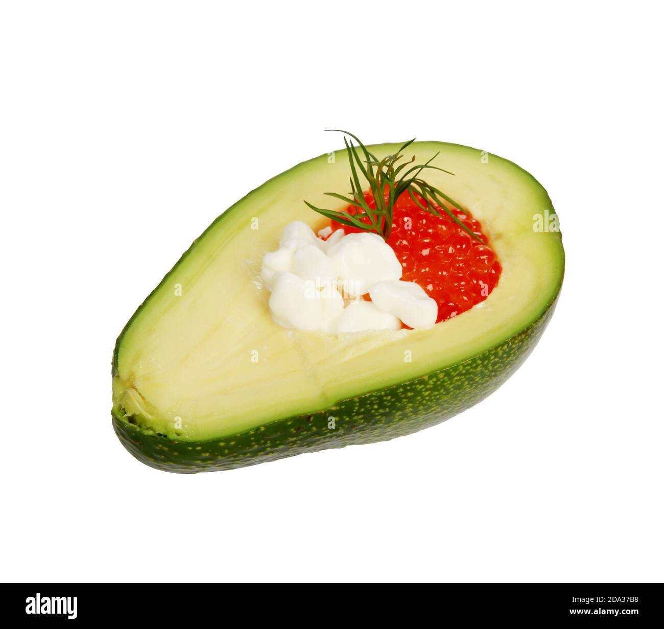 Closeup shot of a fresh avocado with white cheese and red caviar ...