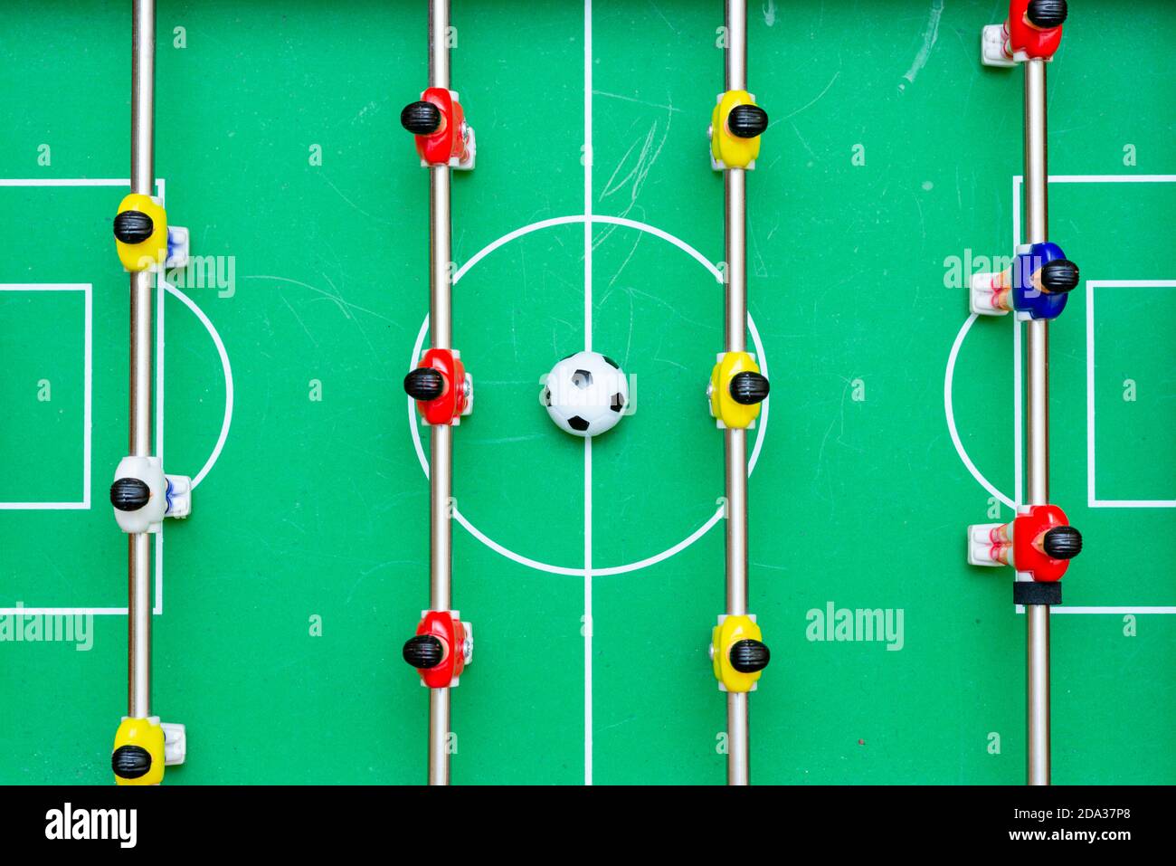 Top view table soccer with red yellow players and a ball Stock Photo ...