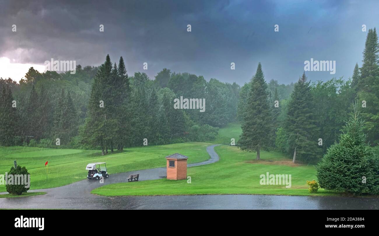 A beautiful green golf course (Nation) on a rainy stormy cloudy summer ...