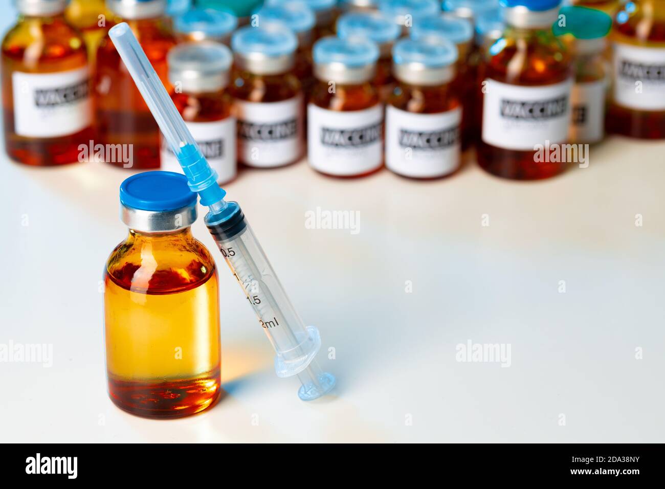 Medical vial with medication and syringe close up Stock Photo - Alamy
