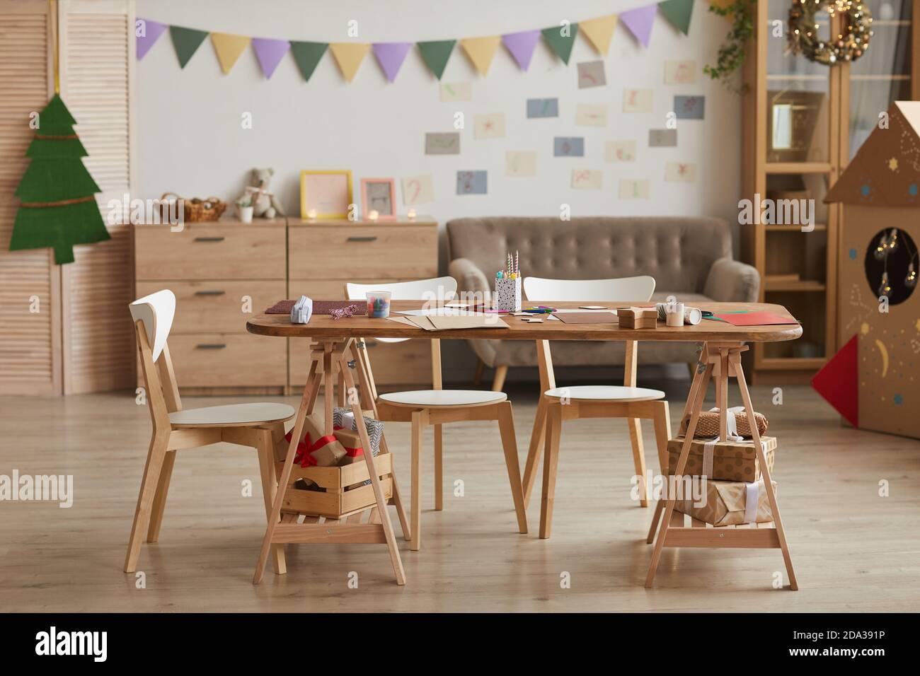 Full length background image of crafting table in empty art class in ...