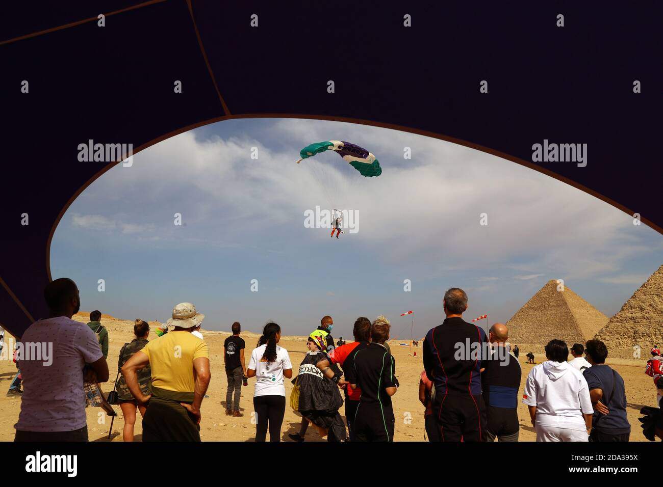 Skydivers flying on parachutes over hi-res stock photography and images ...
