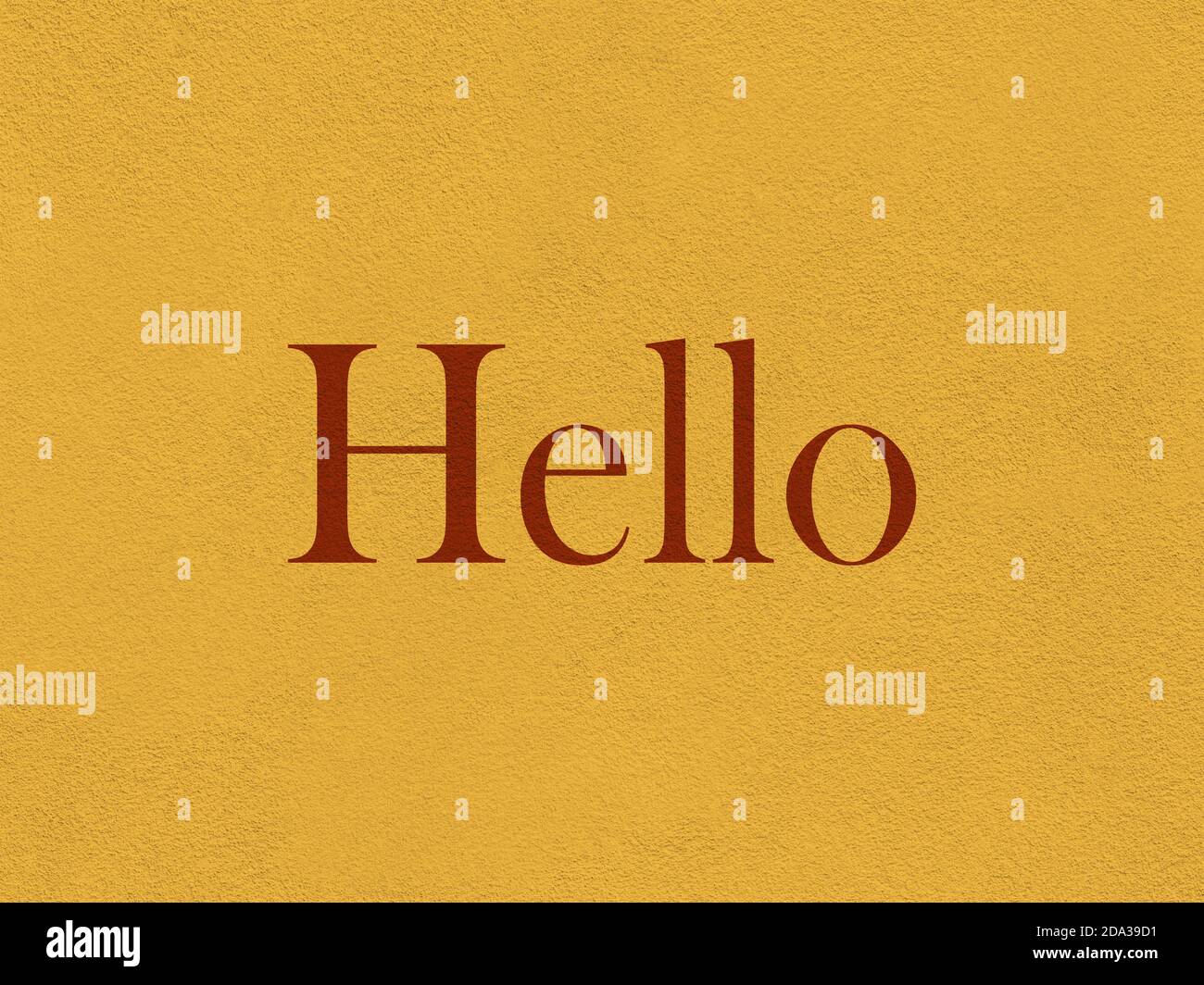 Text Hello on the yellow wall. Background surface Stock Photo - Alamy