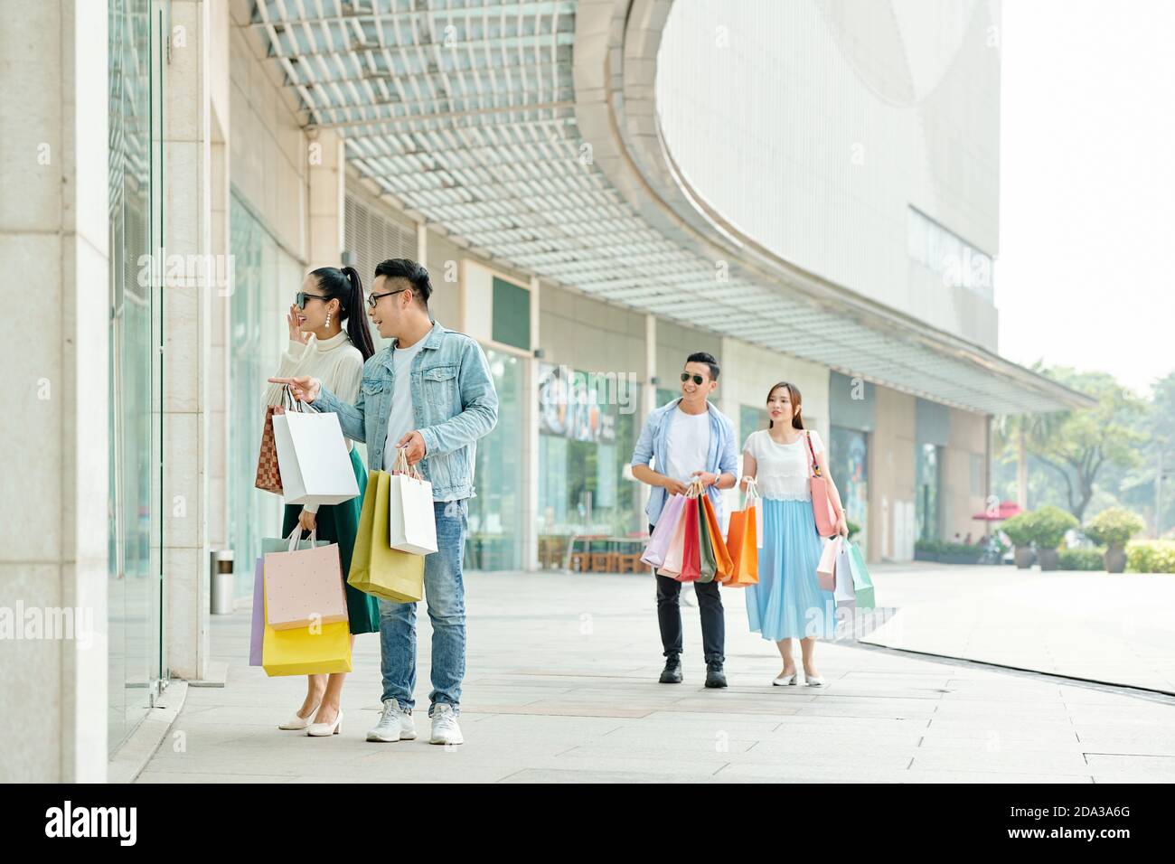 Young people with paper-bags Stock Photo - Alamy