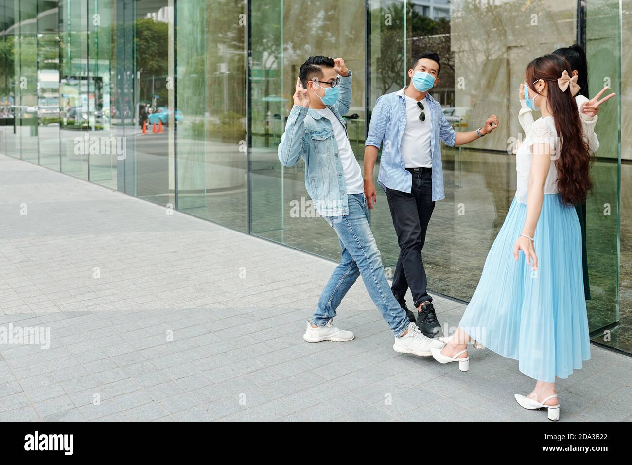 Friends greeting each other Stock Photo - Alamy