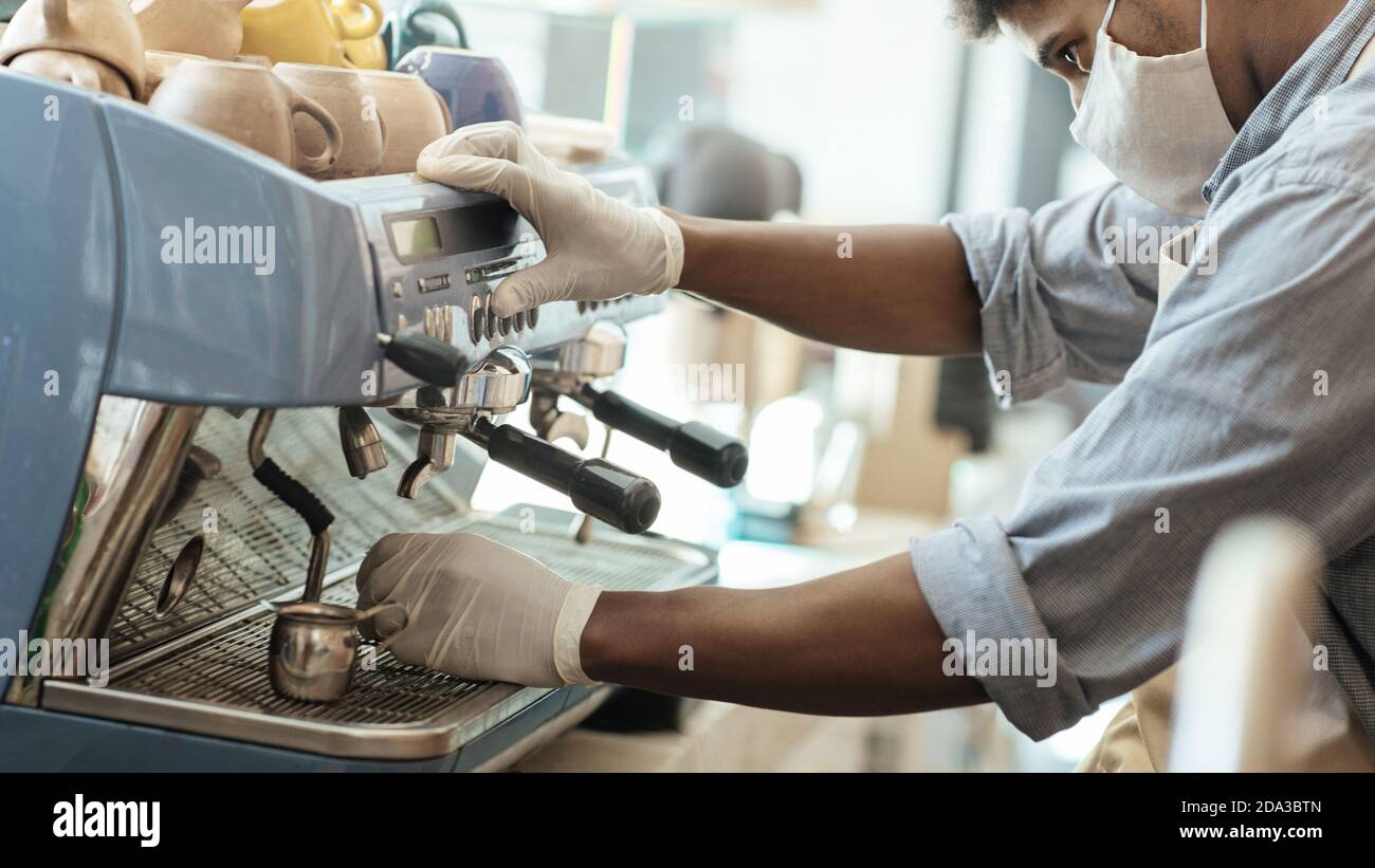 Takeaway coffee in modern cafeteria in morning during COVID-19 pandemic ...