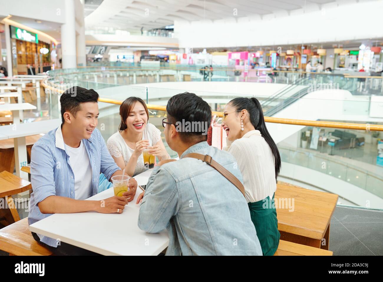 Two couples sitting hi-res stock photography and images - Alamy