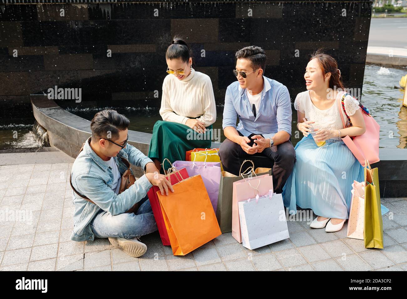 Male friends enjoying at mall hi-res stock photography and images - Alamy