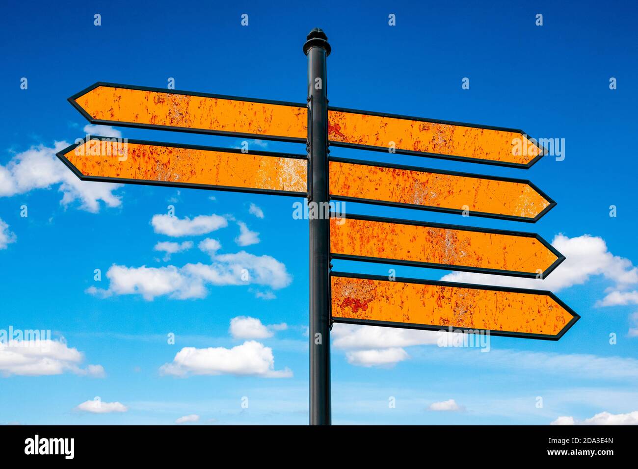 Rusty metal directional signs over cloudy sky background Stock Photo ...