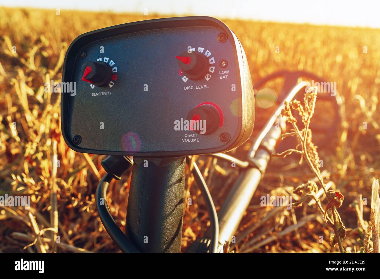 Close up of a metal detector device in a rural field Stock Photo - Alamy