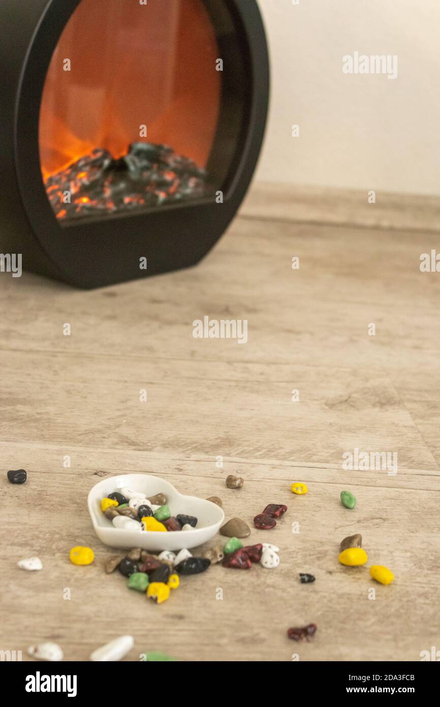 Small decorative fireplace with various sweets and reflections Stock ...