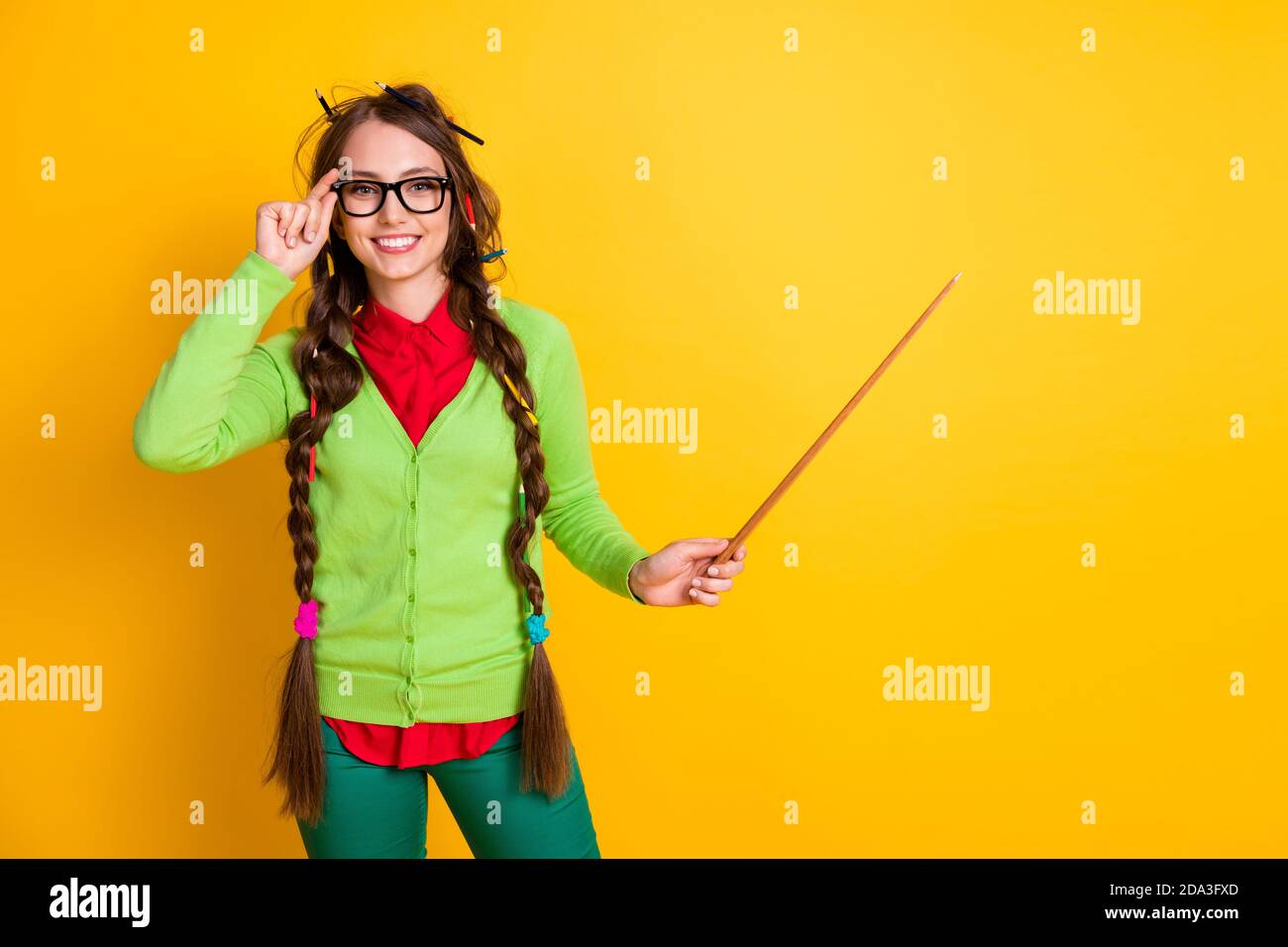 Portrait of attractive funky cheerful clever girl pointing ...