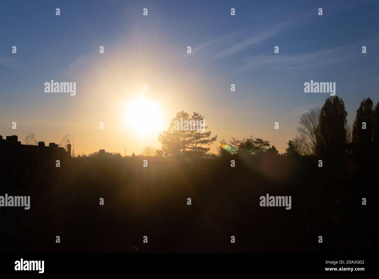 Sun over city roofs hi-res stock photography and images - Alamy