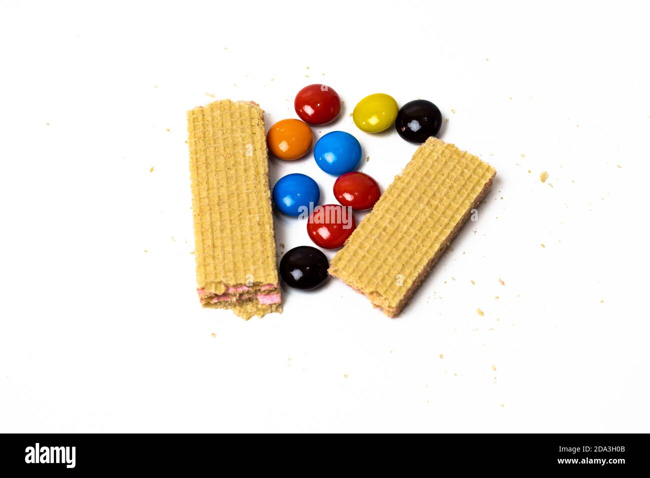 Tasty vanilla wafer with colorful chocolate coated bubble candy ...