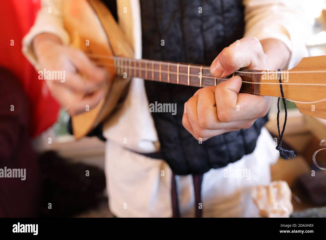 Man plays balalaika at the fair, Russia Stock Photo - Alamy