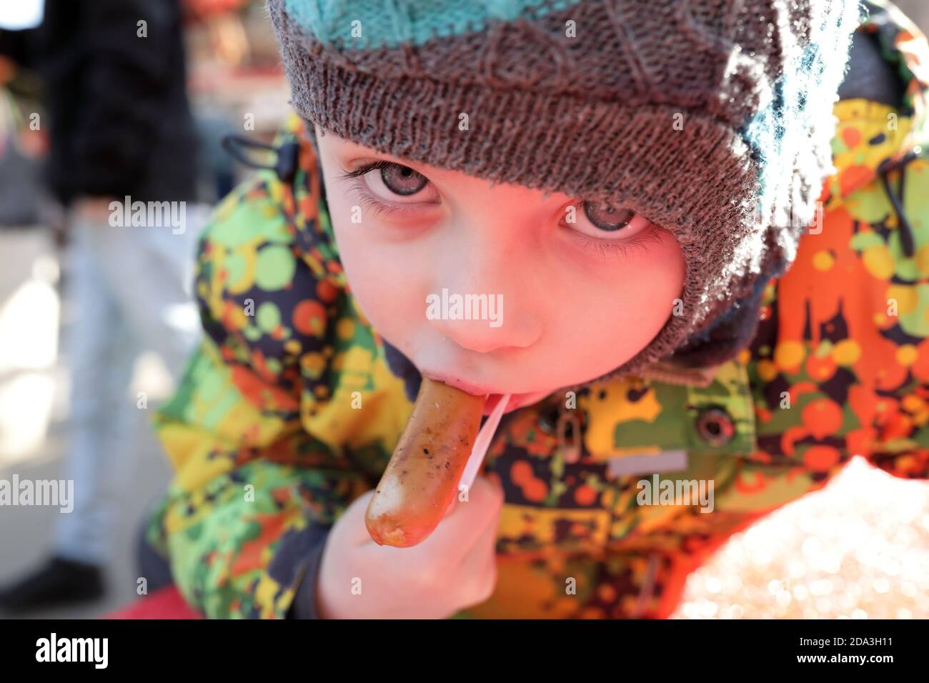 Kid eating sausage on street in Moscow, Russia Stock Photo - Alamy
