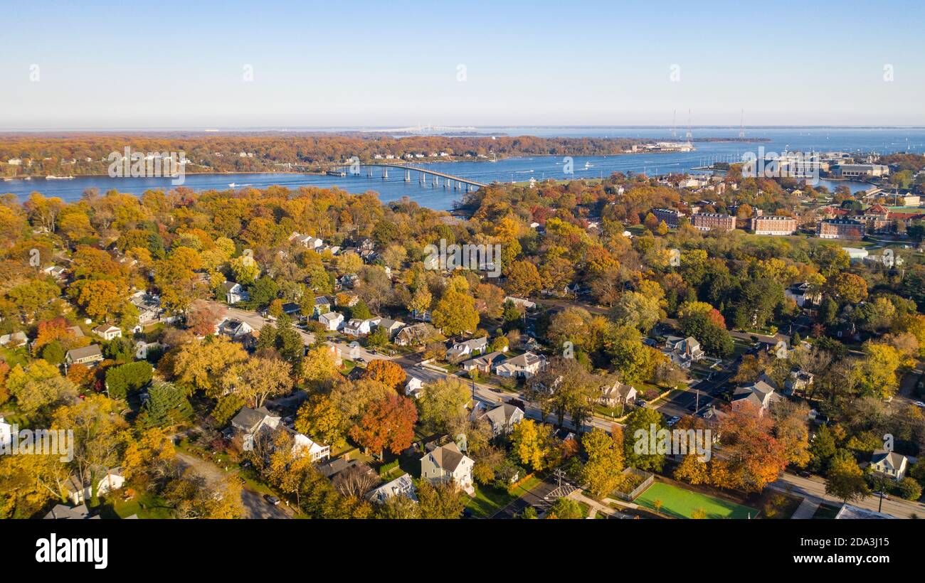 Aerial view of colorful sailboat moorings, docks, and bright golden ...