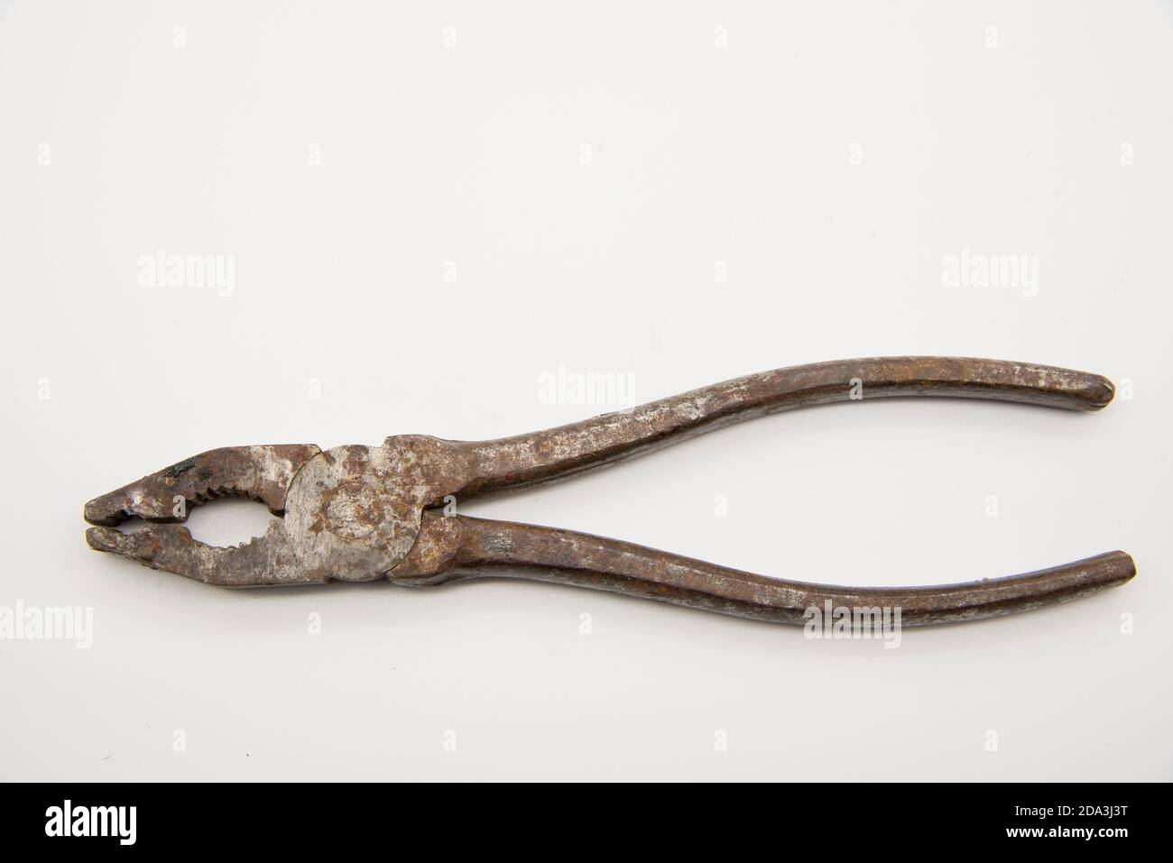 Old rusty pliers on a white background Stock Photo - Alamy