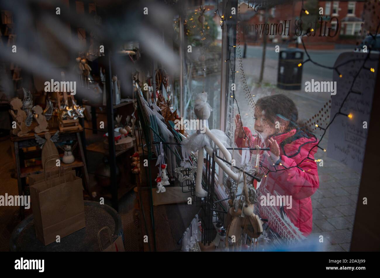 Christmas little girl admiring gifts, Ansdell, Lytham, St Annes ...