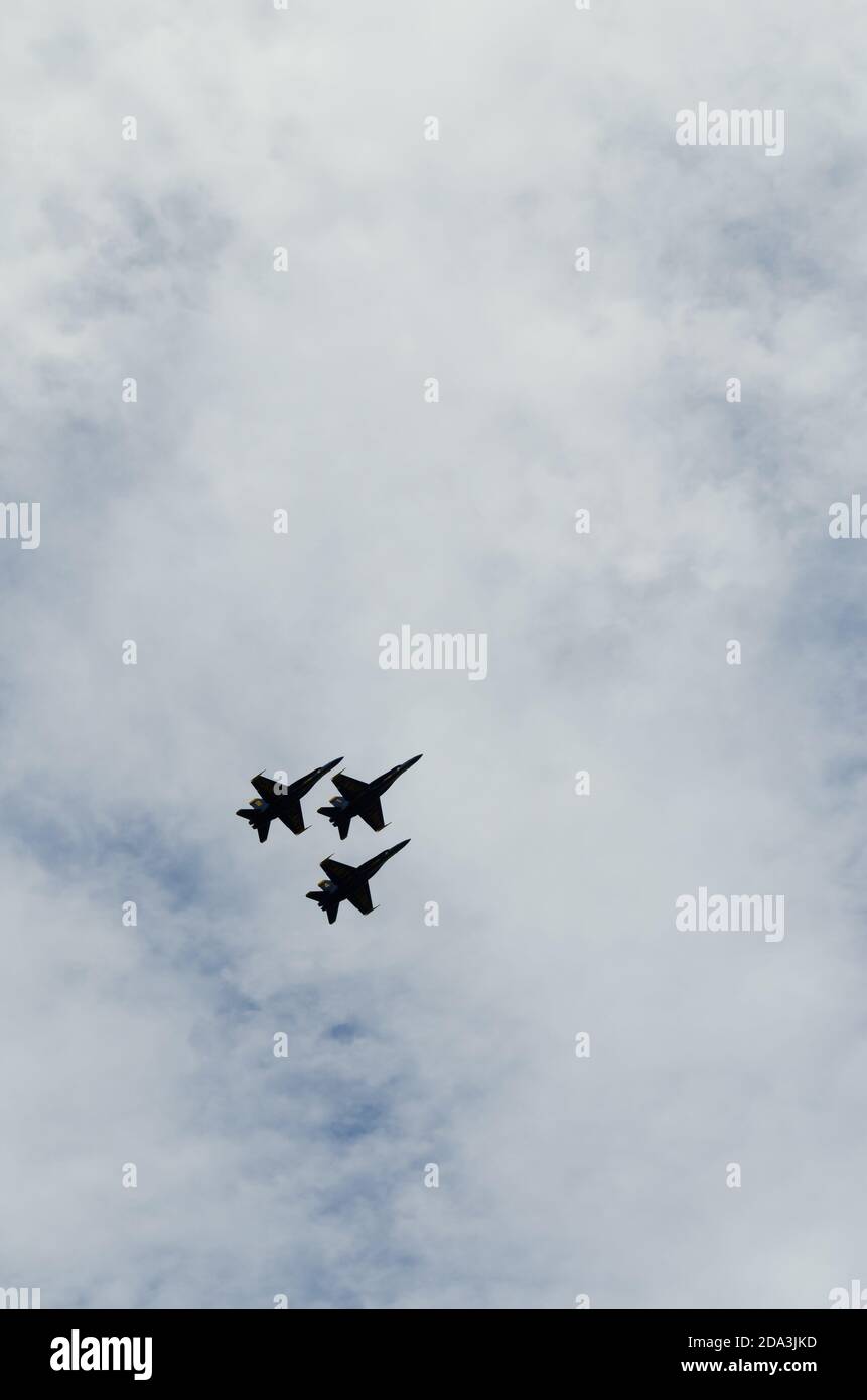 Low angle shot of three fighter jets flying on a gloomy day background ...