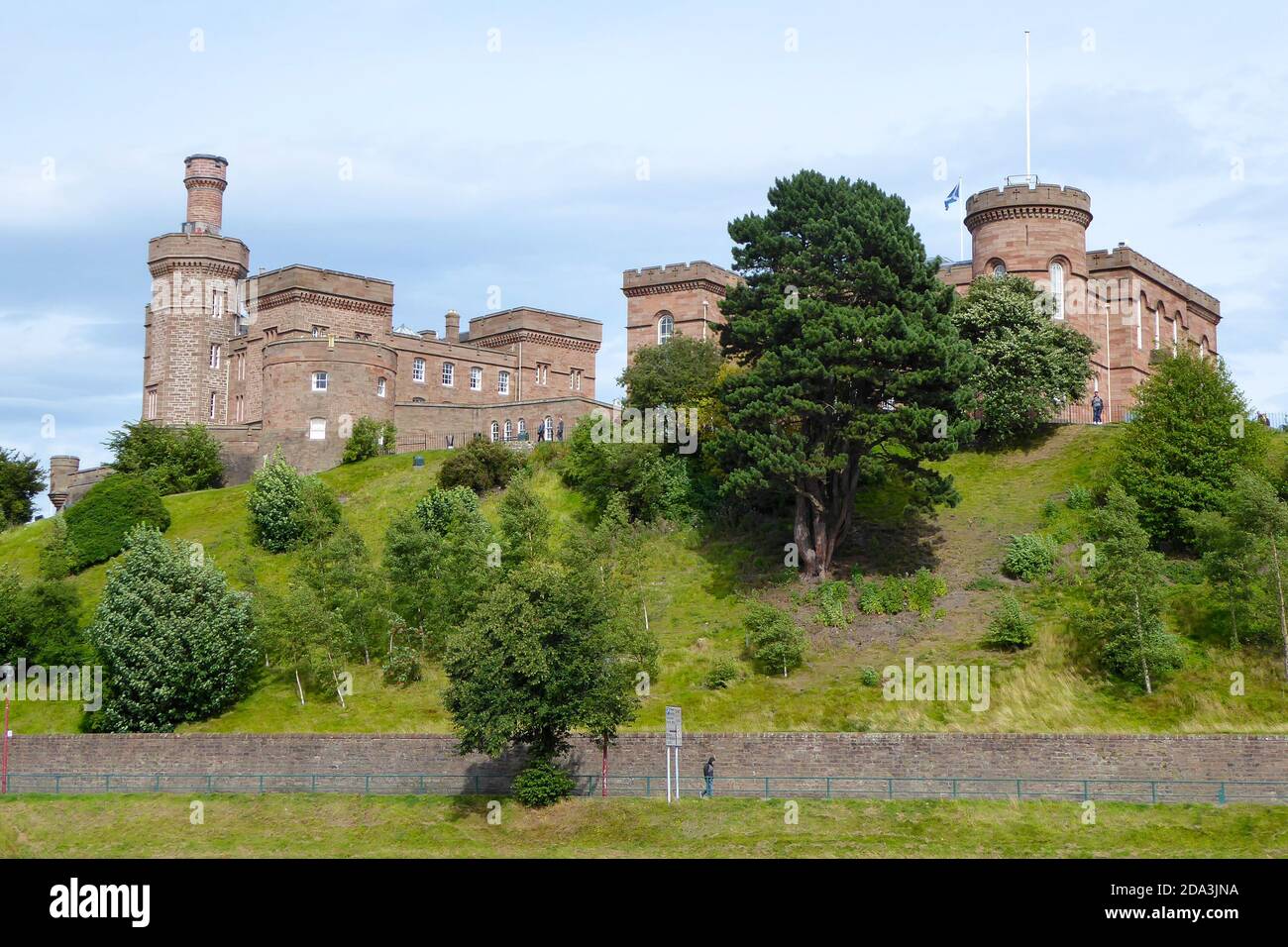 looking up at Inverses castle standing proud surrounded by trees with ...
