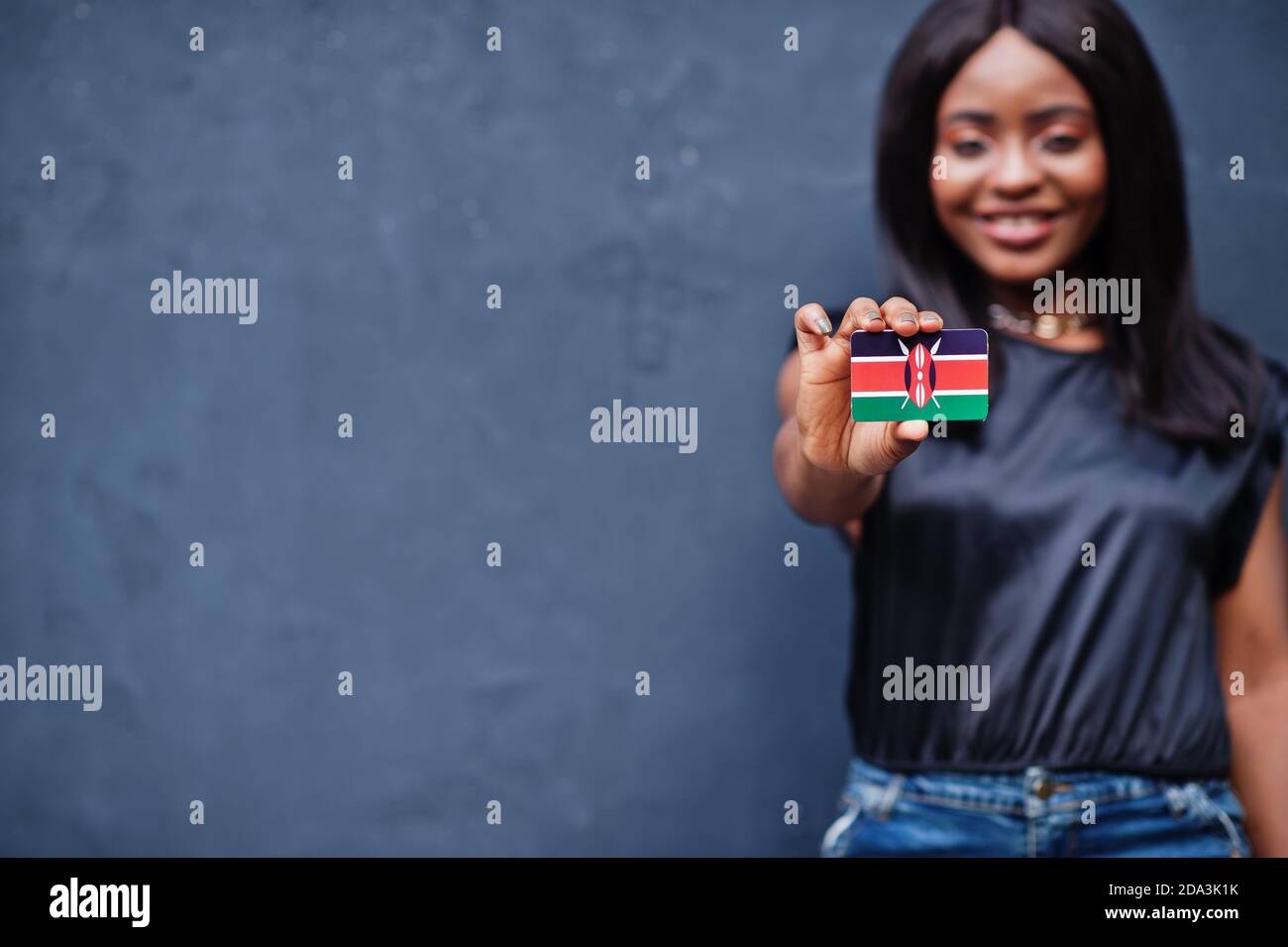 African woman hold small Kenya flag in hands Stock Photo - Alamy