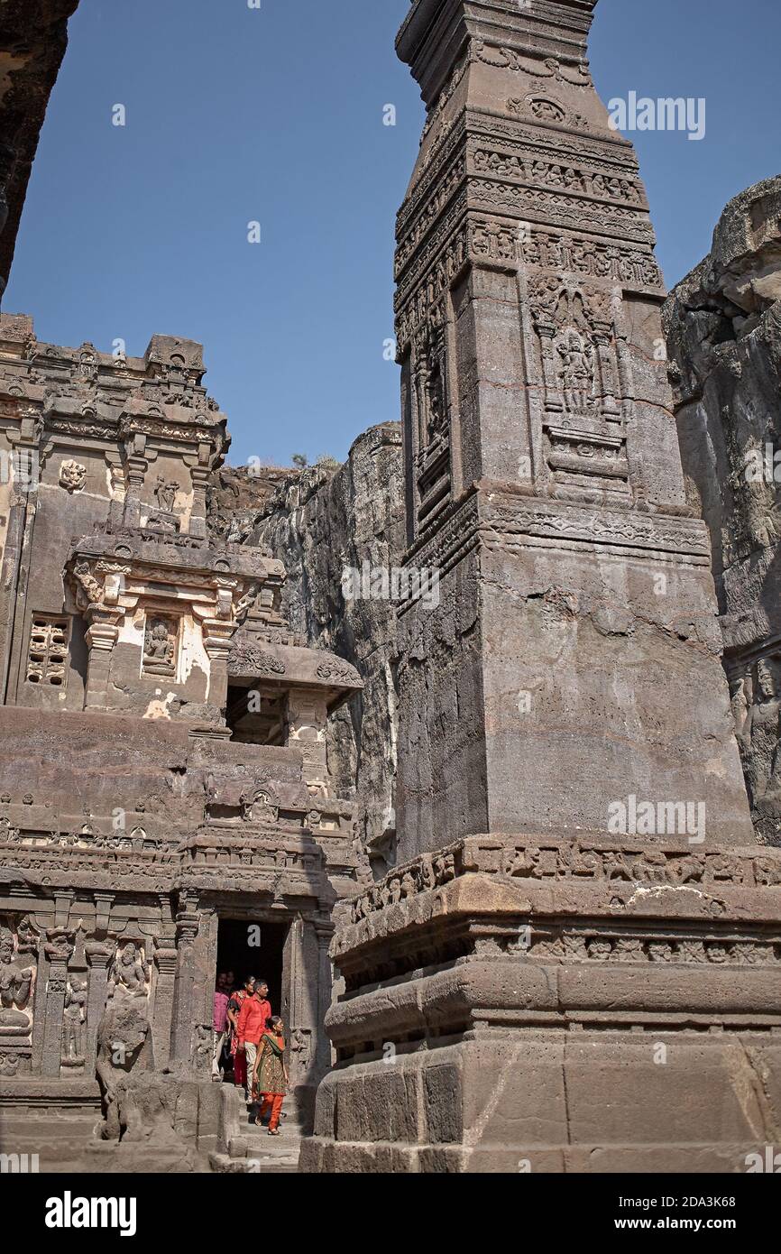 Ellora, India, May 2012. Local tourists walking through cave temples ...