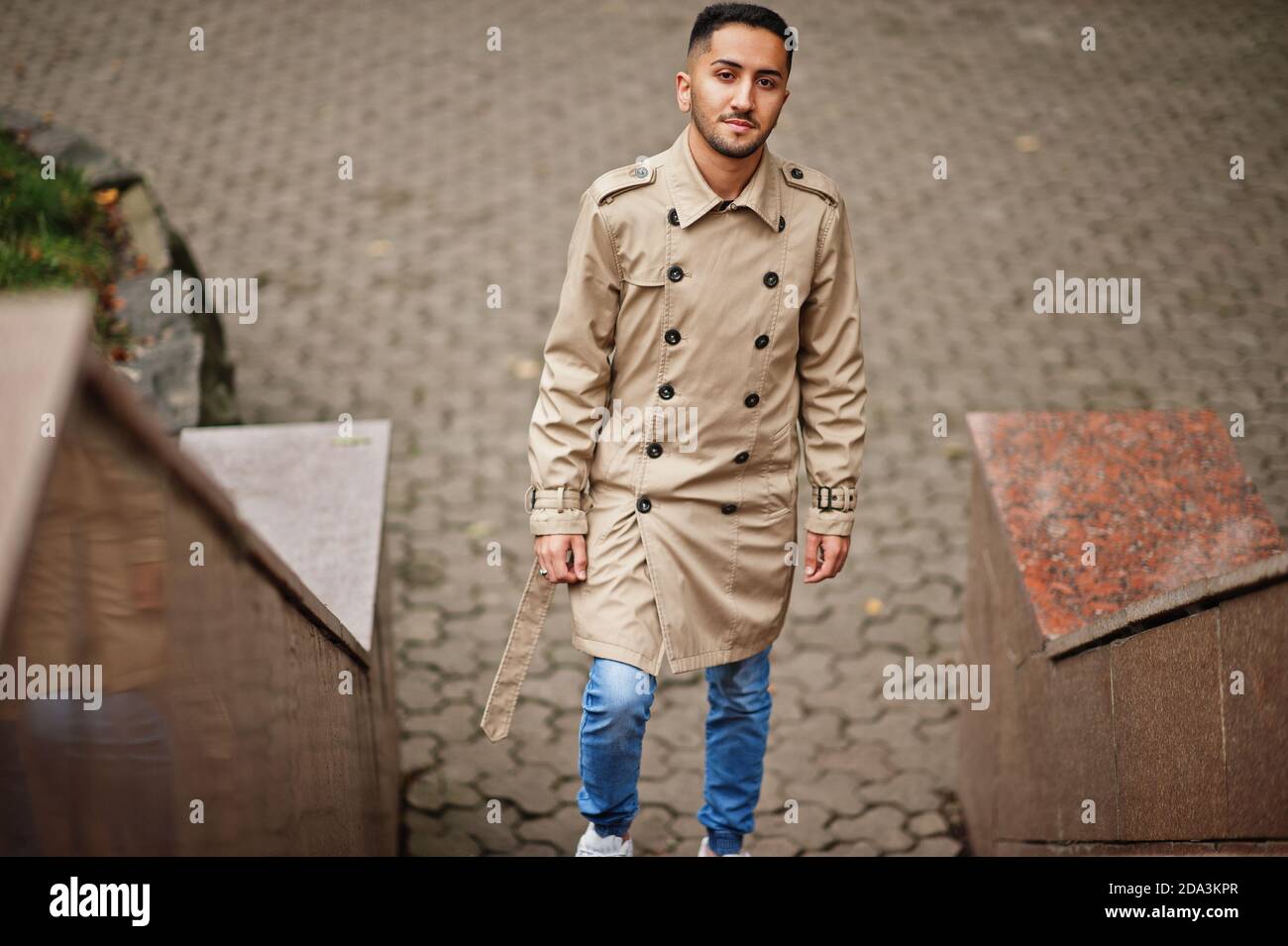 Stylish kuwaiti man at trench coat Stock Photo - Alamy