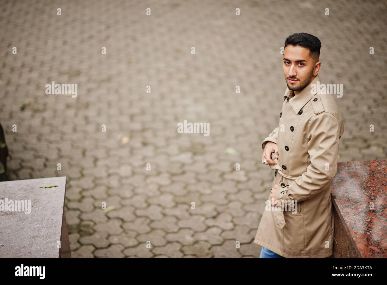 Stylish kuwaiti man at trench coat Stock Photo - Alamy