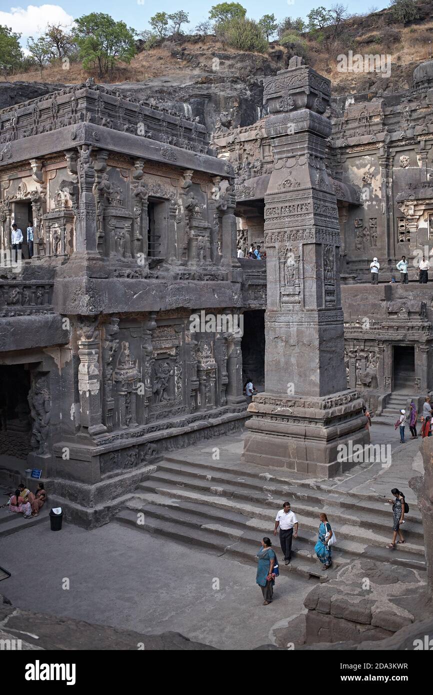 Ellora, India, May 2012. Local tourists walking through cave temples ...