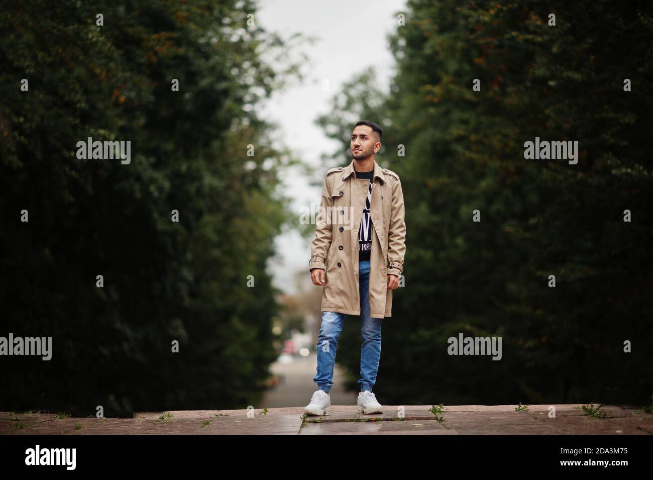 Stylish kuwaiti man at trench coat Stock Photo - Alamy