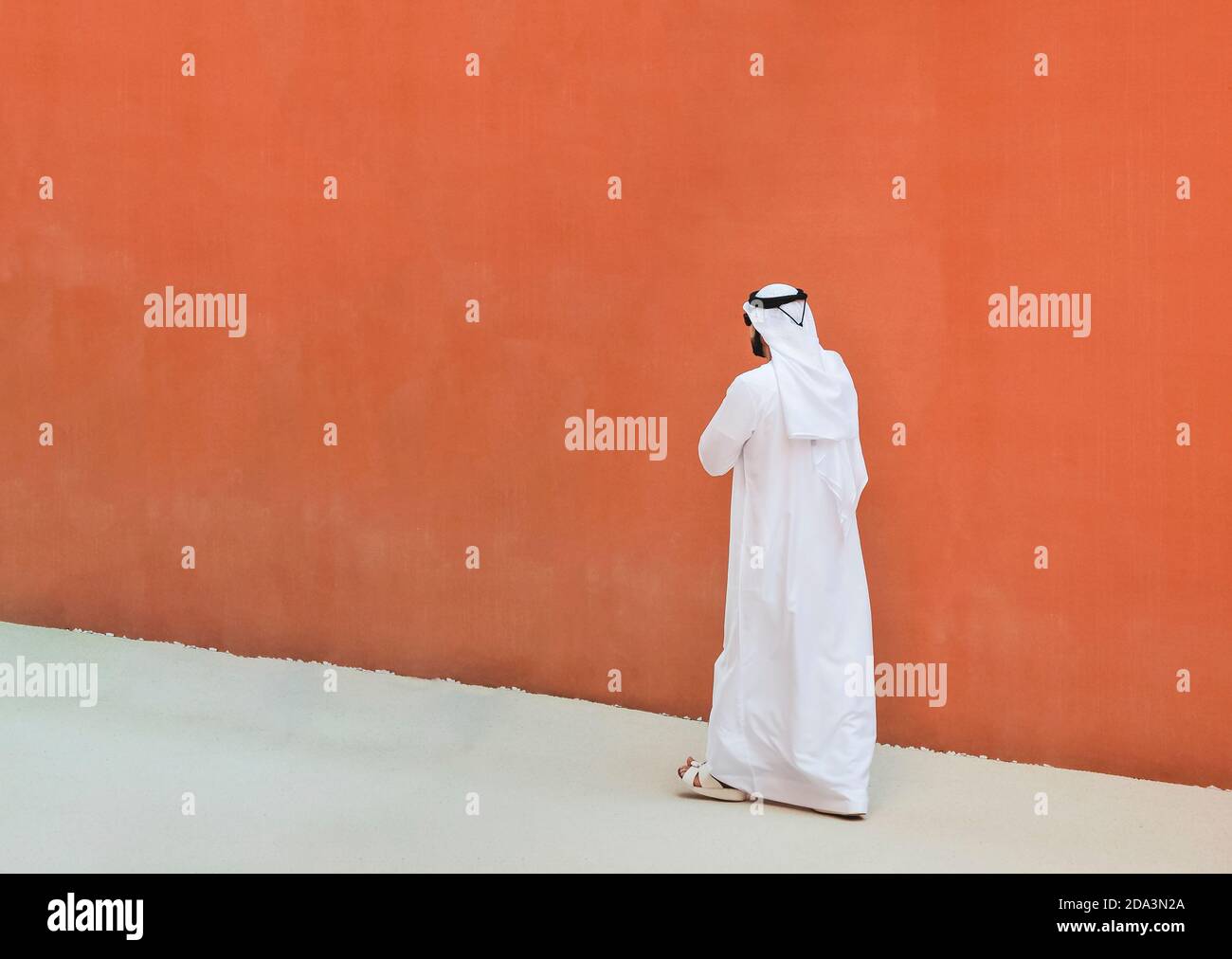 Rear view arab man walking hi-res stock photography and images - Alamy