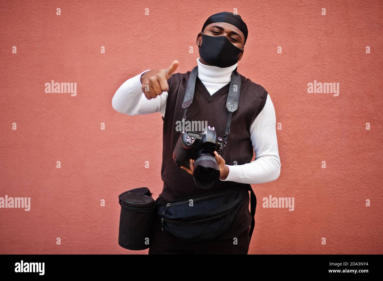 Young professional african american videographer holding professional ...