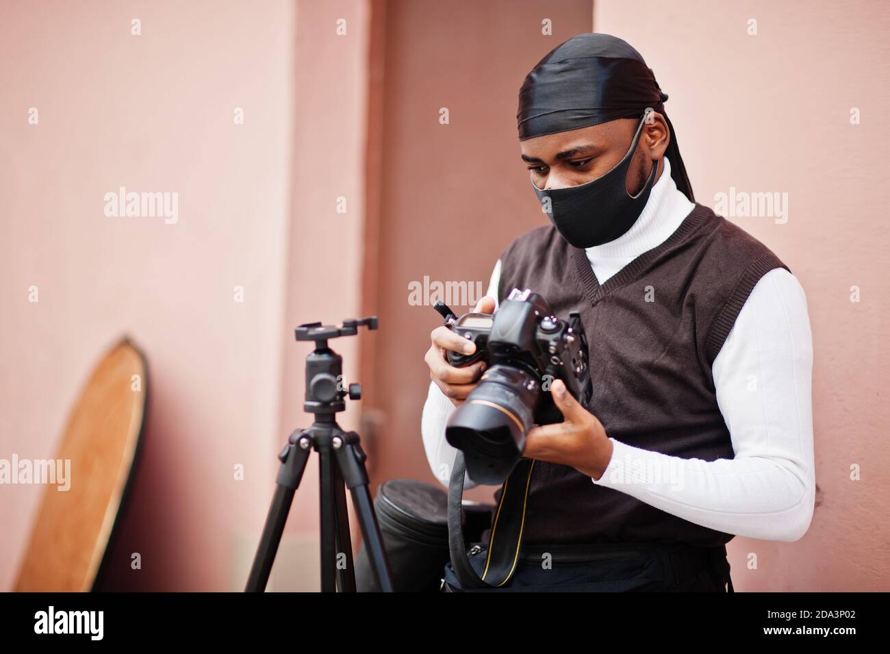 Young professional african american videographer holding professional ...