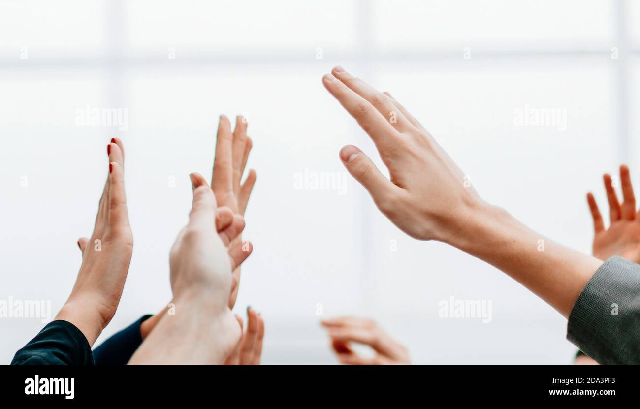 business team giving each other a high five Stock Photo - Alamy