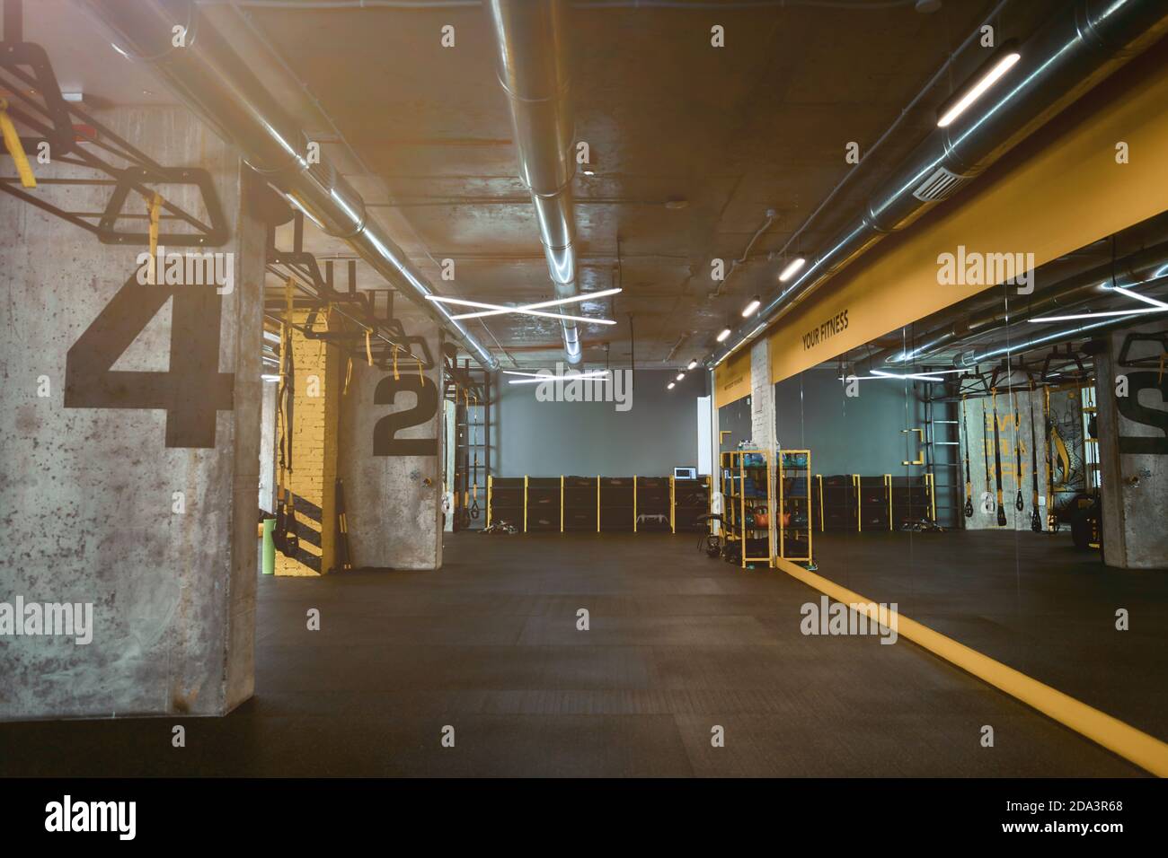 Modern empty crossfit gym or fitness studio. Sport concept, health club ...