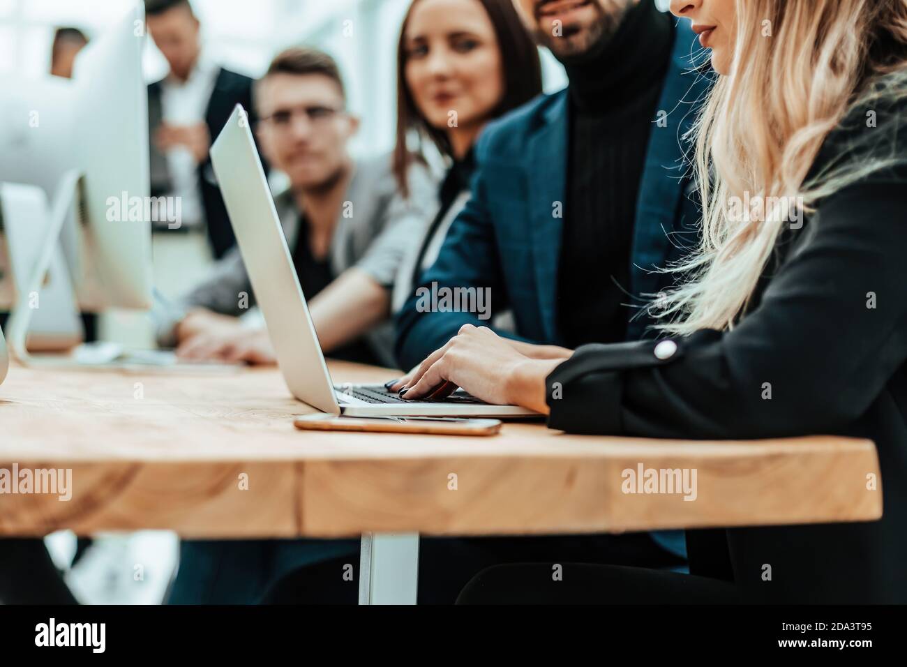 close up. working group sitting at the office Desk Stock Photo - Alamy