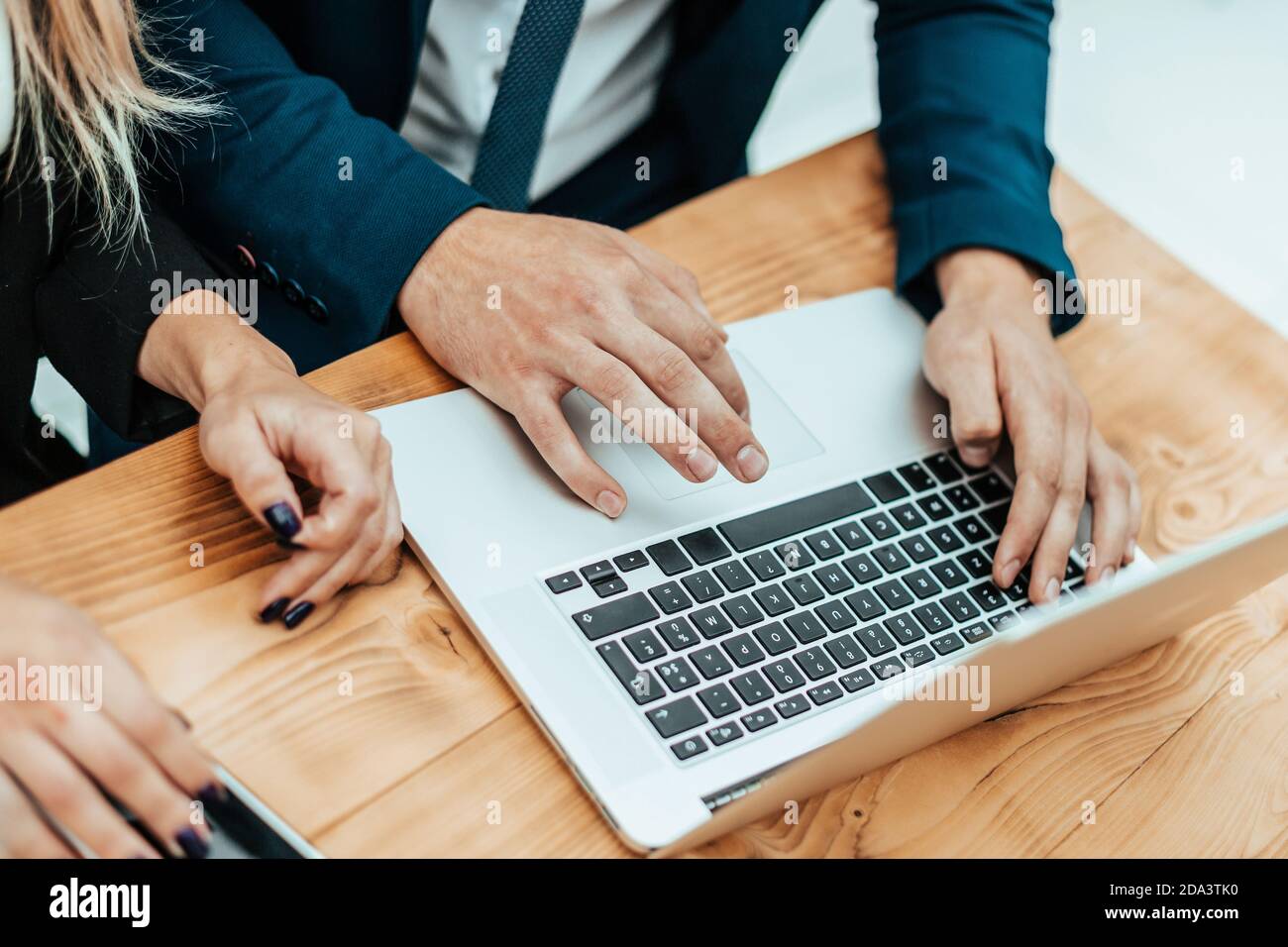 close up. employees use a laptop to view the information they need ...