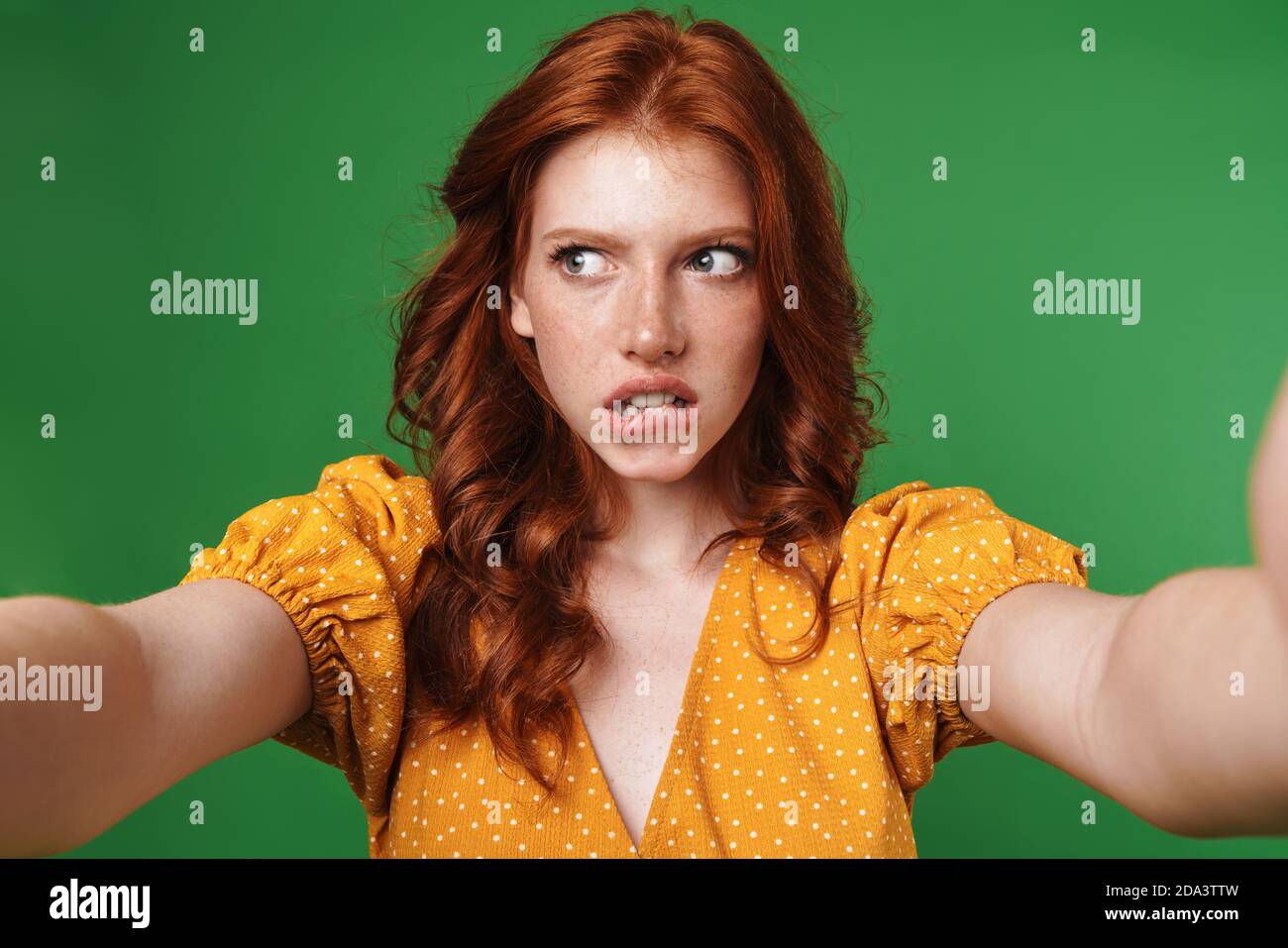 Image of redhead scared nice girl taking selfie photo isolated over ...