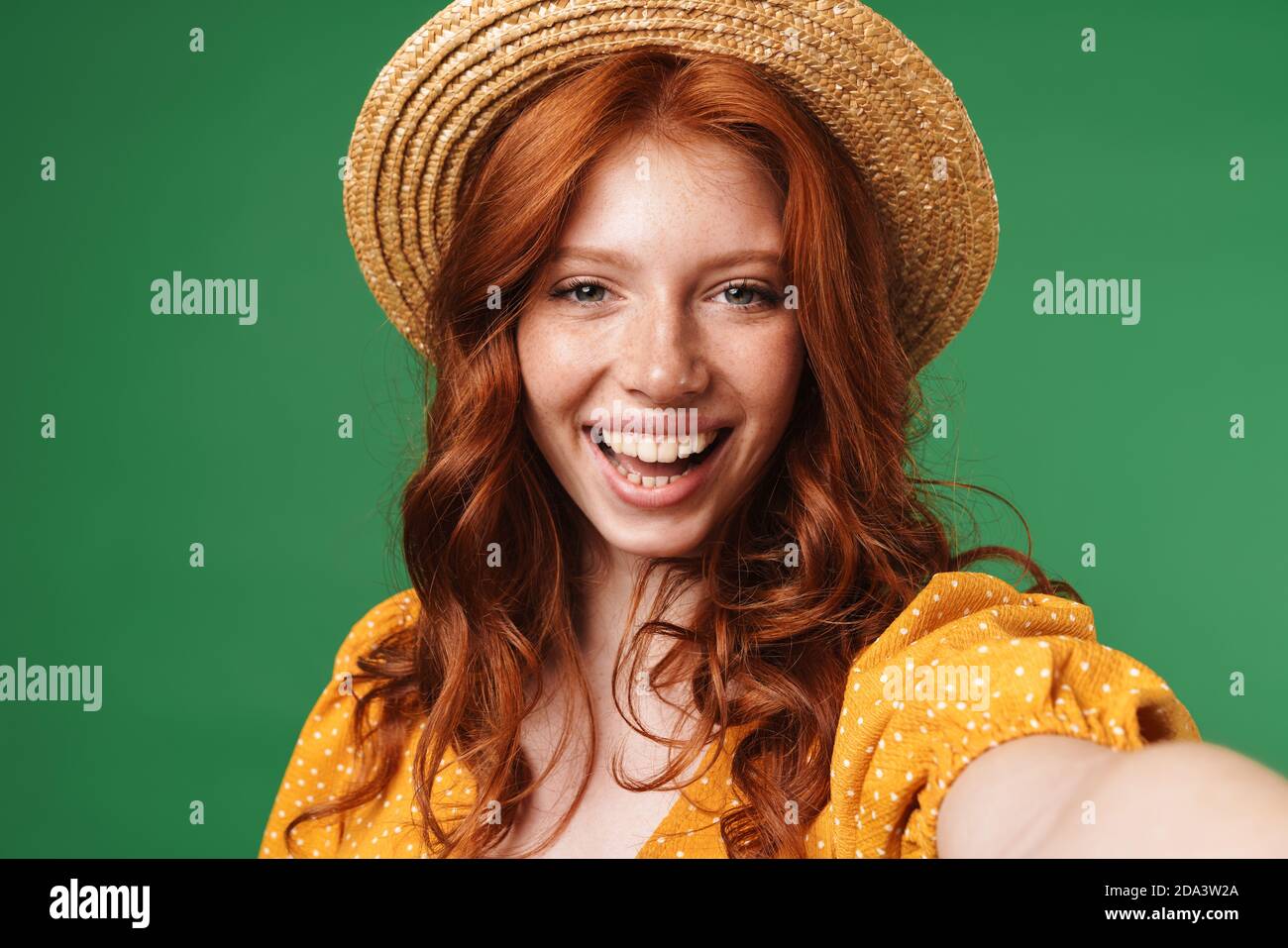 Image Of Ginger Joyful Girl In Straw Hat Smiling And Taking Selfie