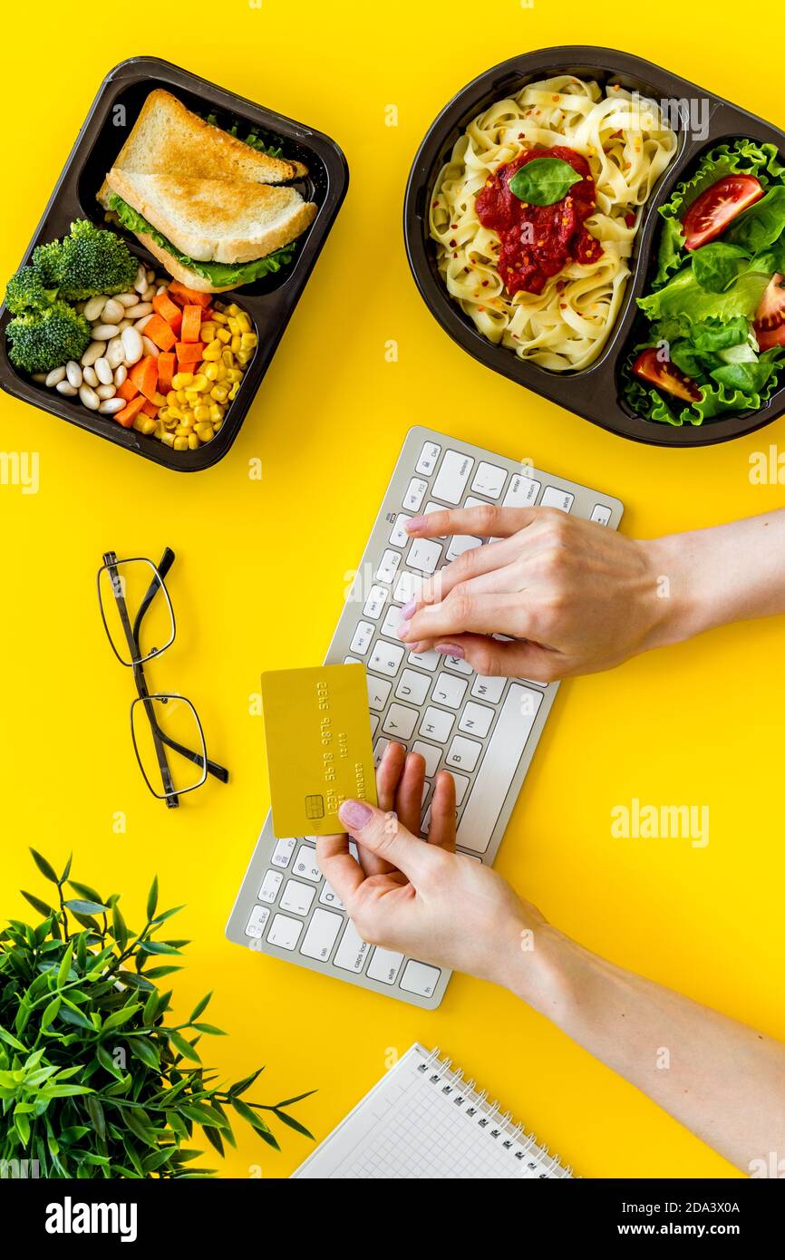 Woman using desktop app to order lunch with delivery Stock Photo - Alamy