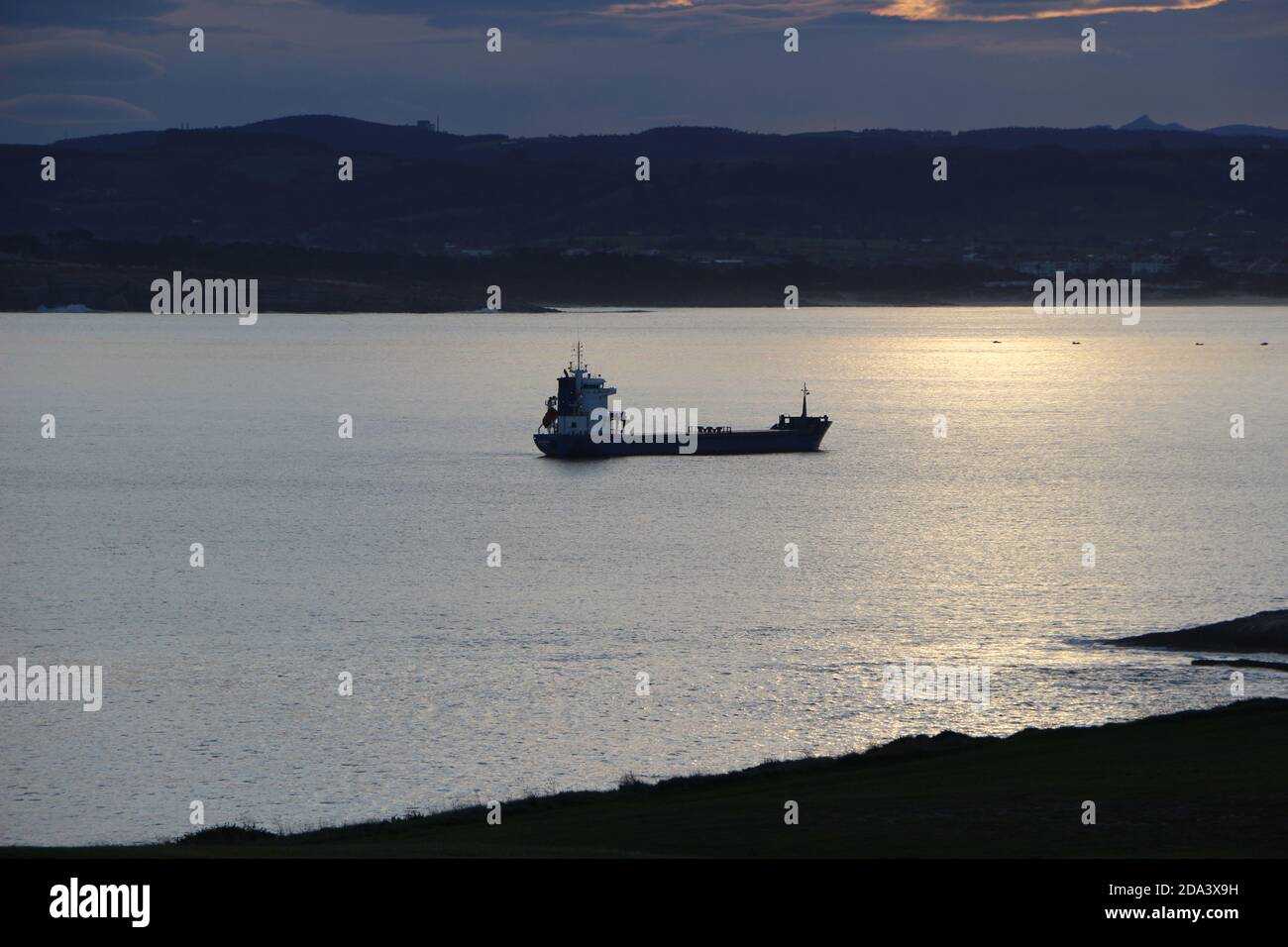 Anchored general cargo ship Ezaro at the entrance to the bay and port ...