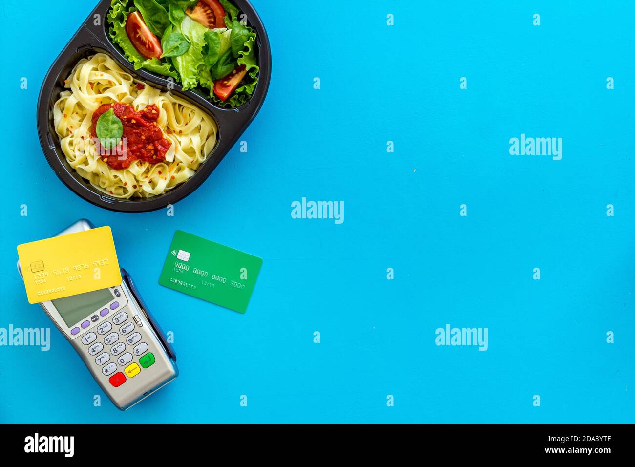 Food delivery payment with terminal and lunch boxes with meal Stock ...