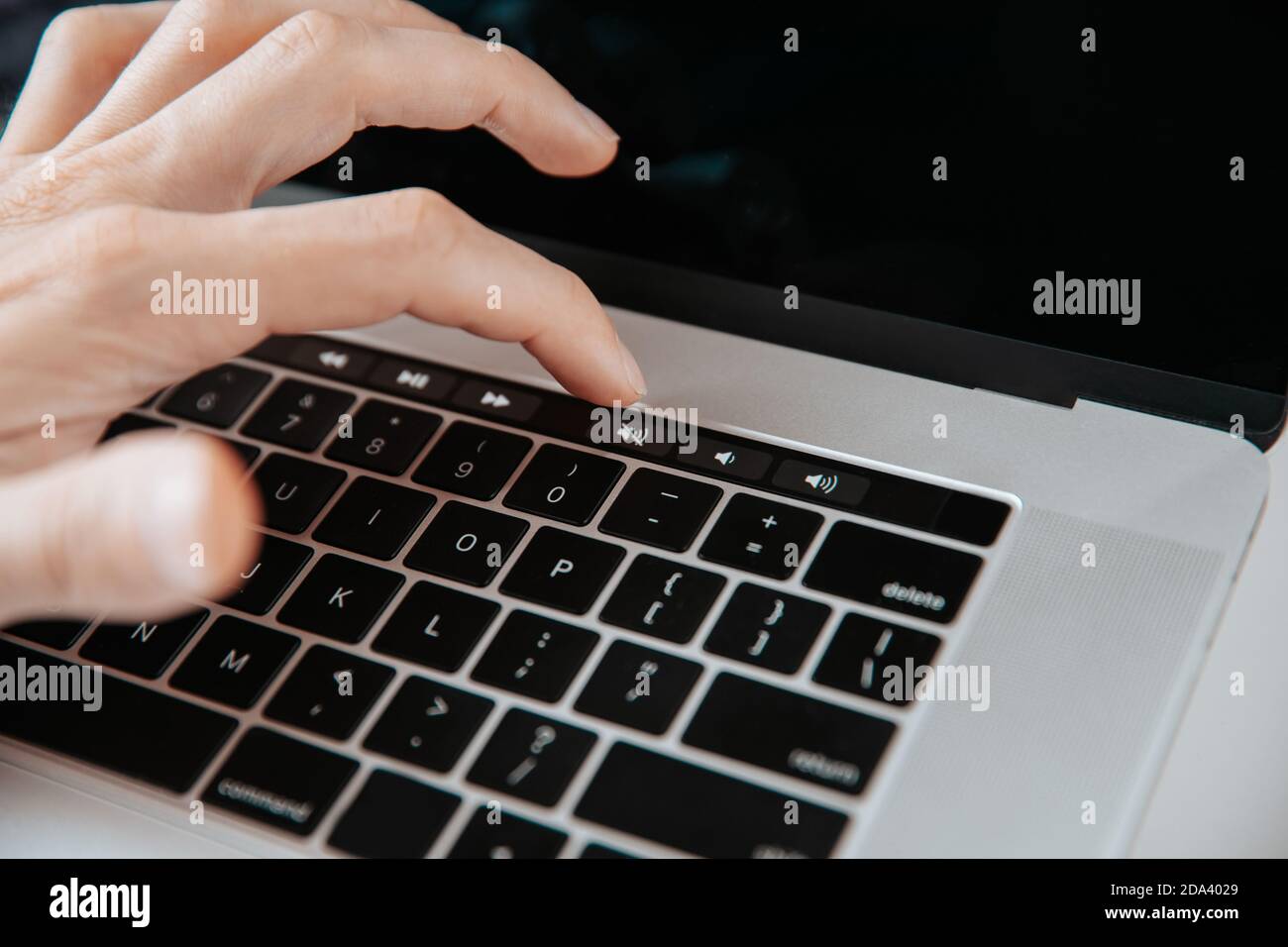 close up. man turning off the sound on his laptop Stock Photo - Alamy
