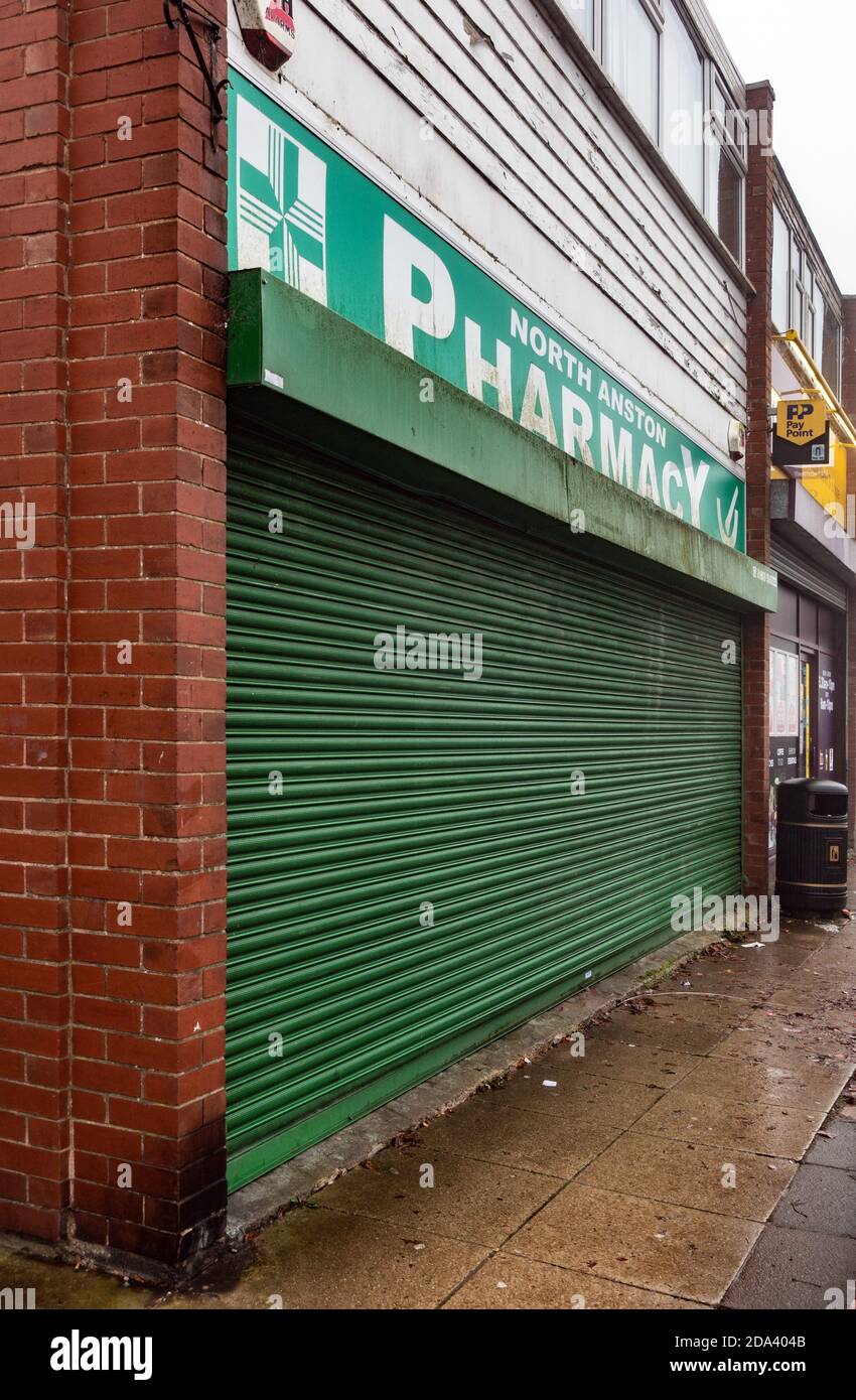 Pharmacy closed with shutters down Stock Photo - Alamy