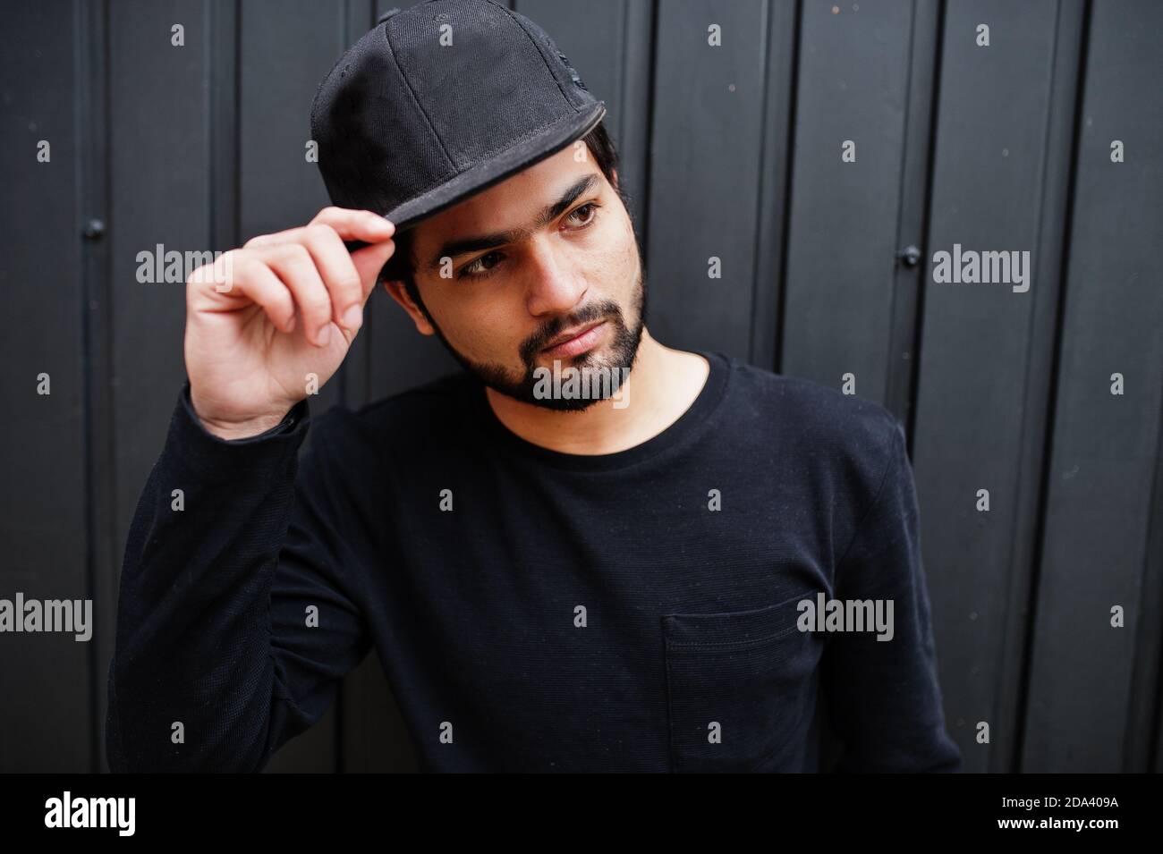 Urban young hipster indian man wear all in black. Cool south asian guy ...
