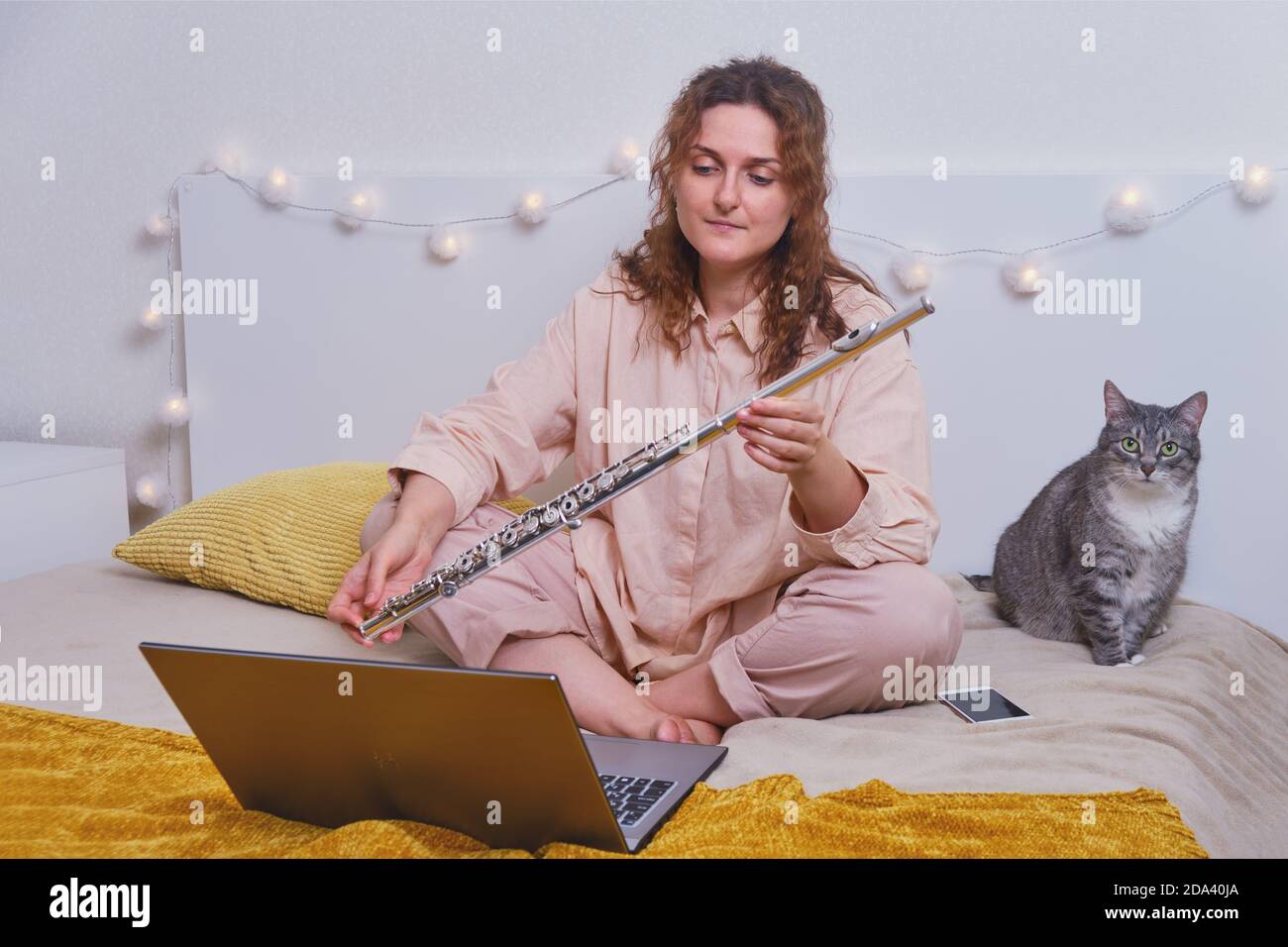 Teacher shows how to play a musical instrument, learning via the ...