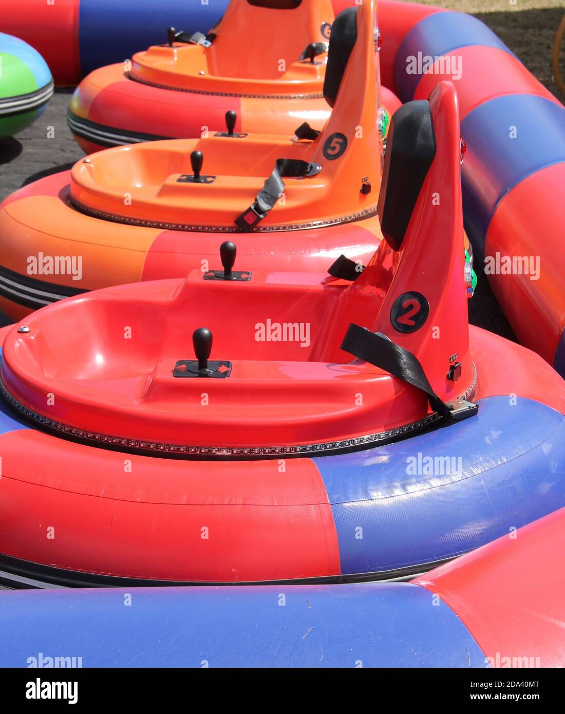 A Row of Fun Carts on a Fun Fair Amusement Ride Stock Photo - Alamy
